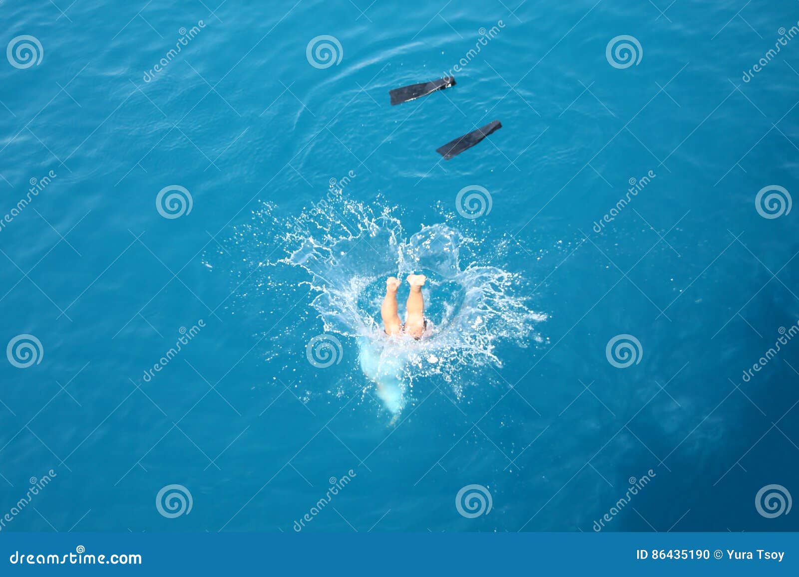Man Jump into the Water with Splashes and Flippers Stock Photo - Image ...