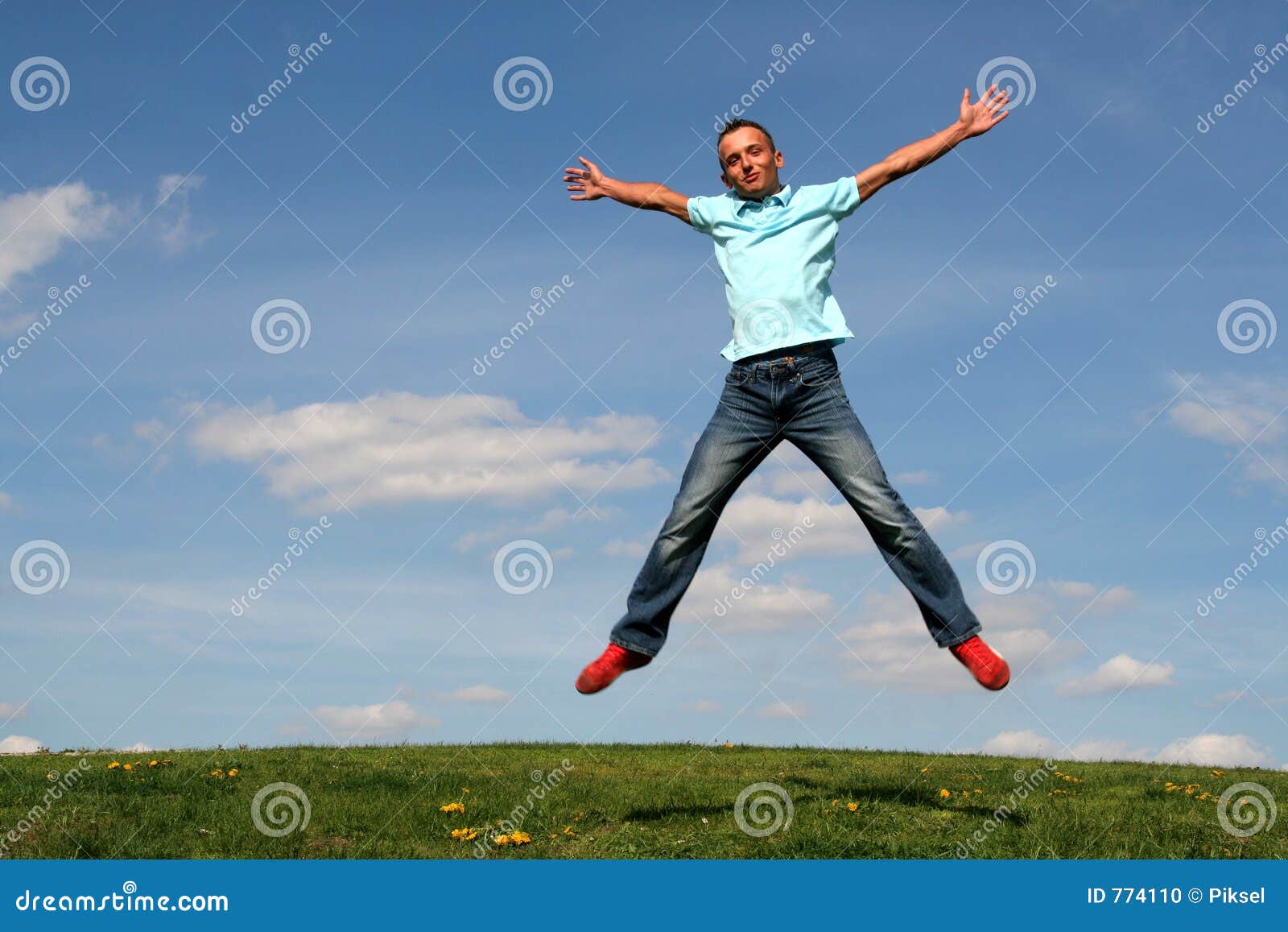 Man jumping stock photo. Image of freetime, green, clouds - 774110