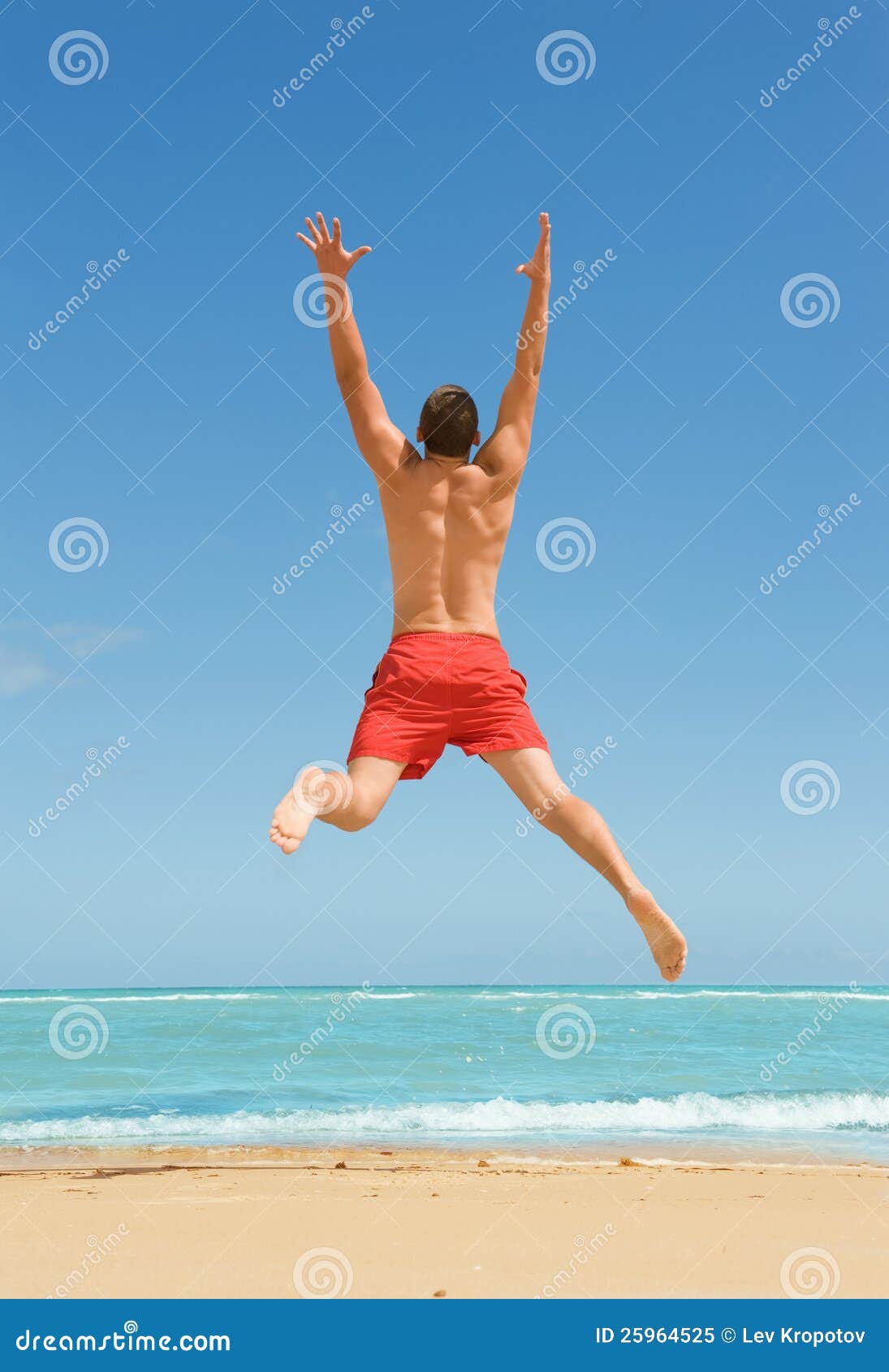 Man jumping on the beach stock image. Image of energy - 25964525