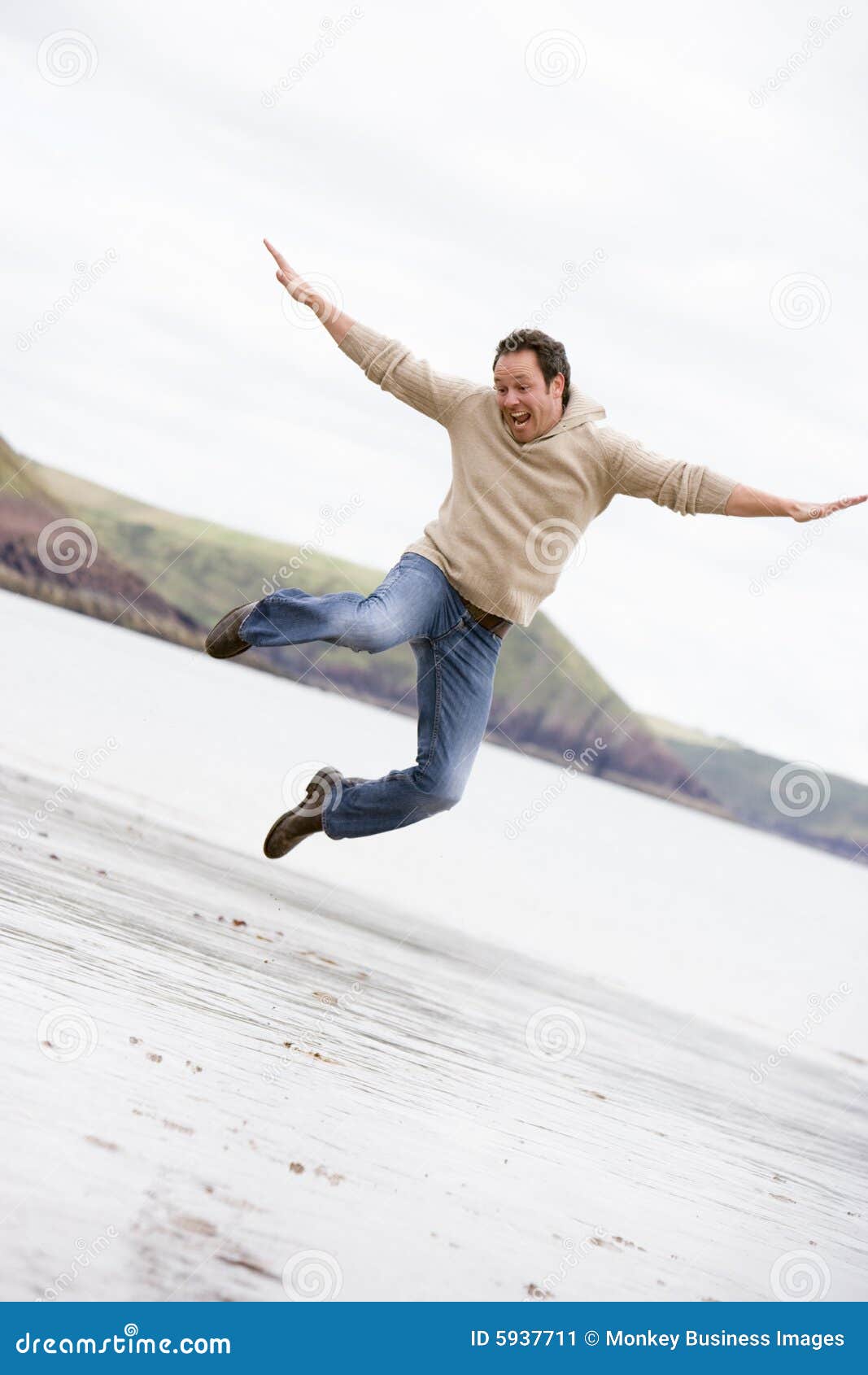 Man jumping on beach stock image. Image of full, outside - 5937711