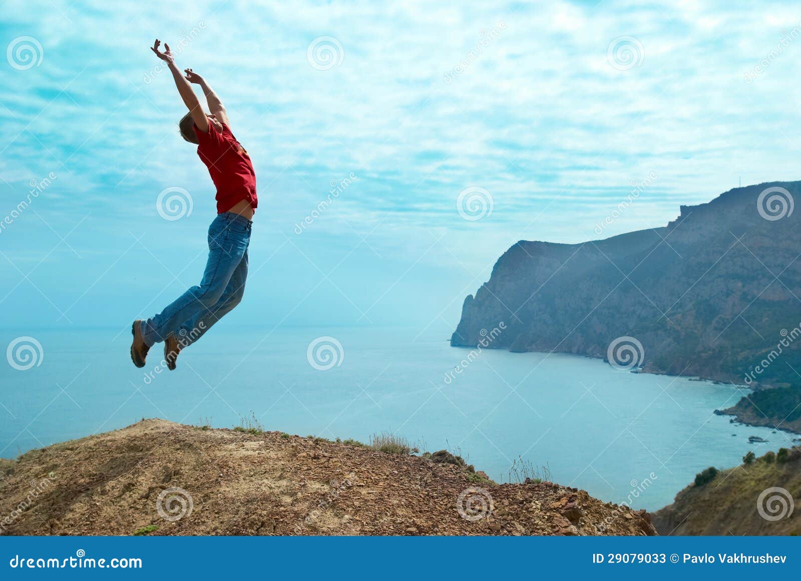 Jumping From The Cliff Near Sarakiniko Beach In Milos In The Cyclades ...