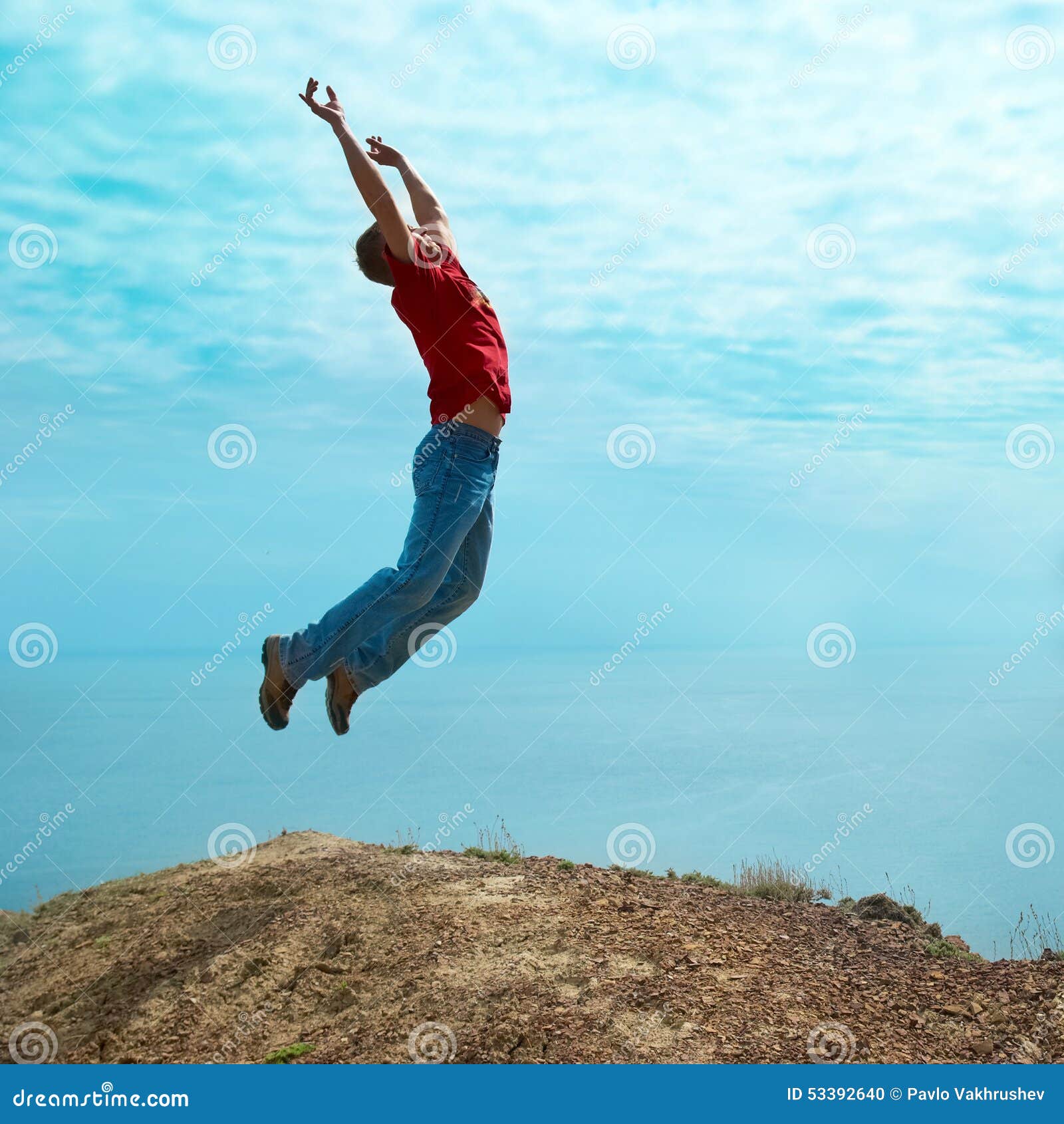 Jumping From The Cliff Near Sarakiniko Beach In Milos In The Cyclades ...