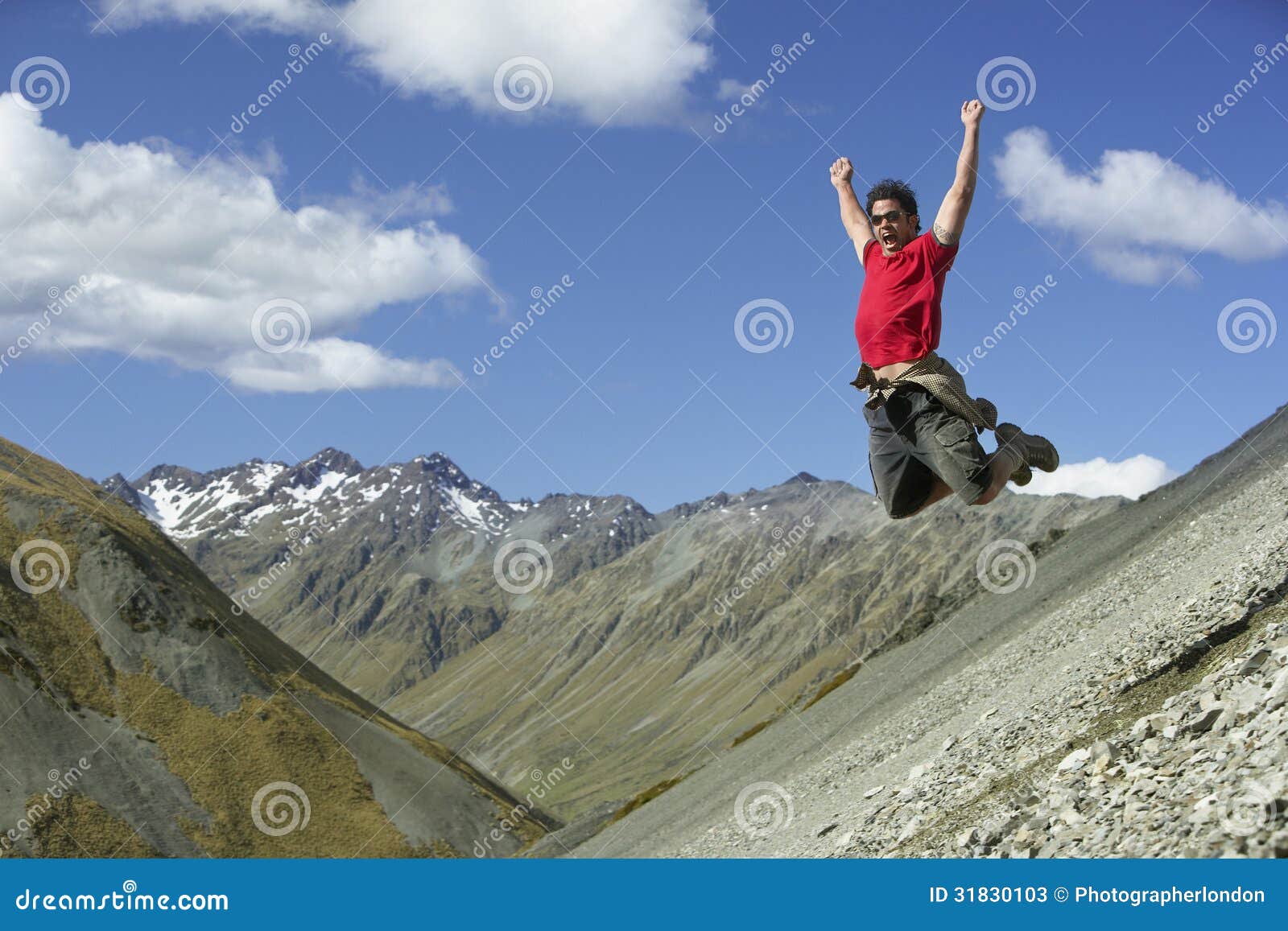 Man Jumping Down Rocky Slope Stock Image - Image of mountain, downhill ...