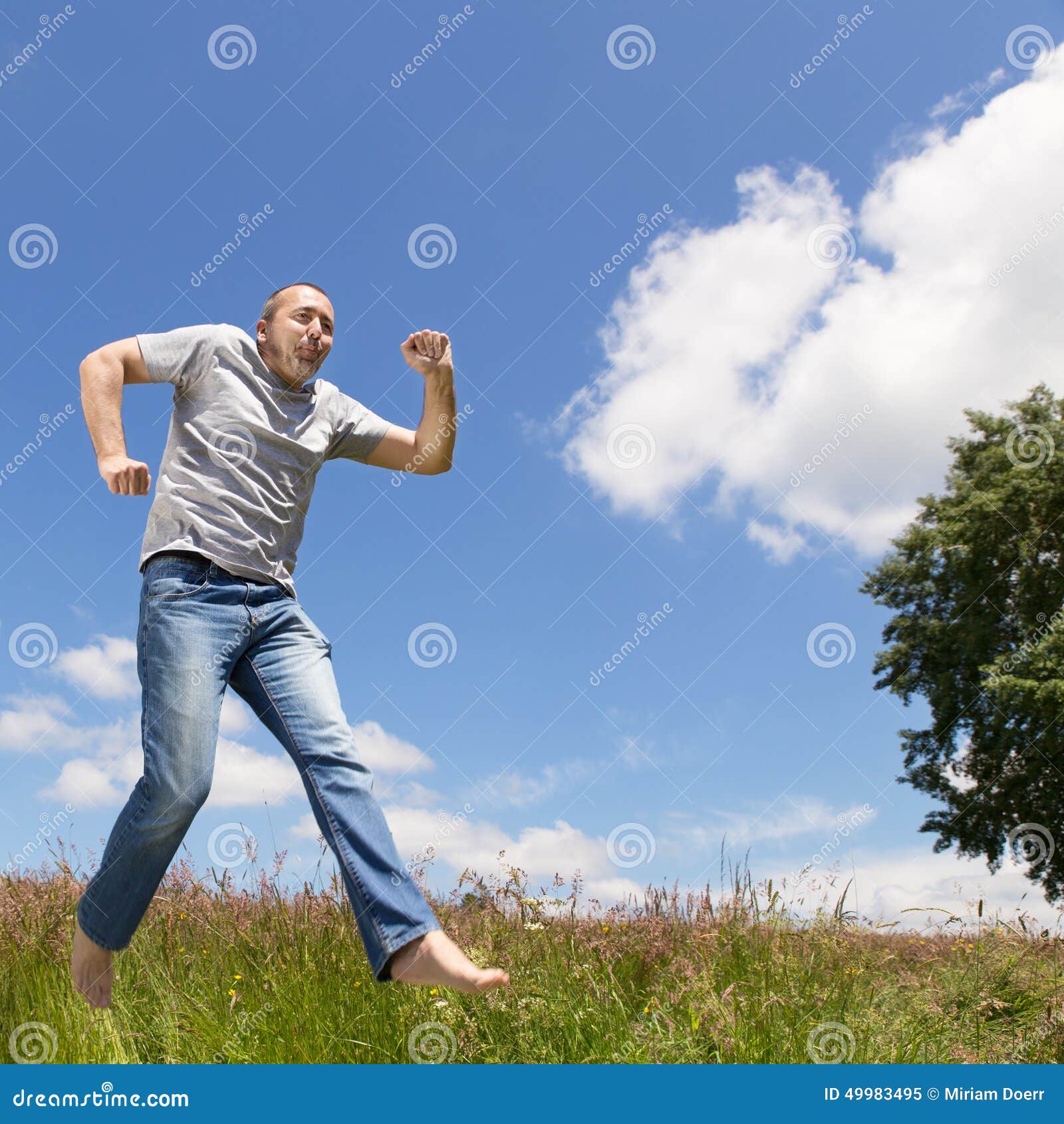 Man is Jumping in Front of Blue Sky Stock Image - Image of blue, energy ...