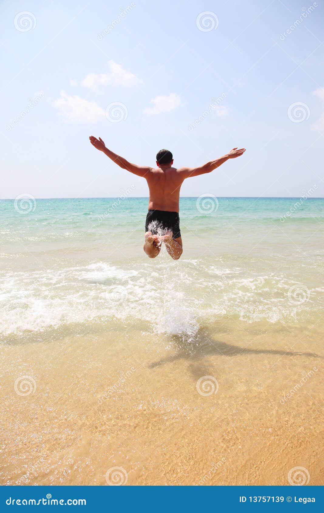 Man Jumping High Up into the Air Stock Image - Image of beach ...