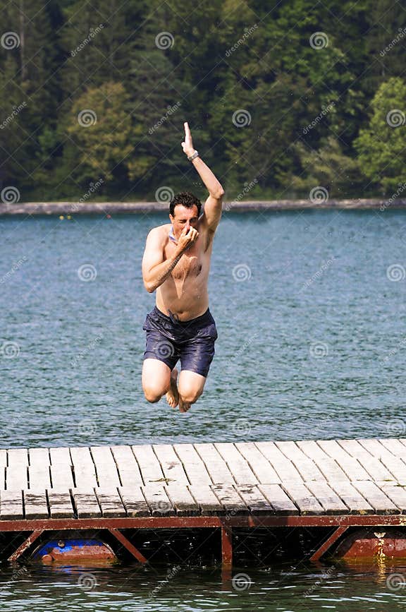 Man jumping into the lake stock photo. Image of dive, adult - 6731652