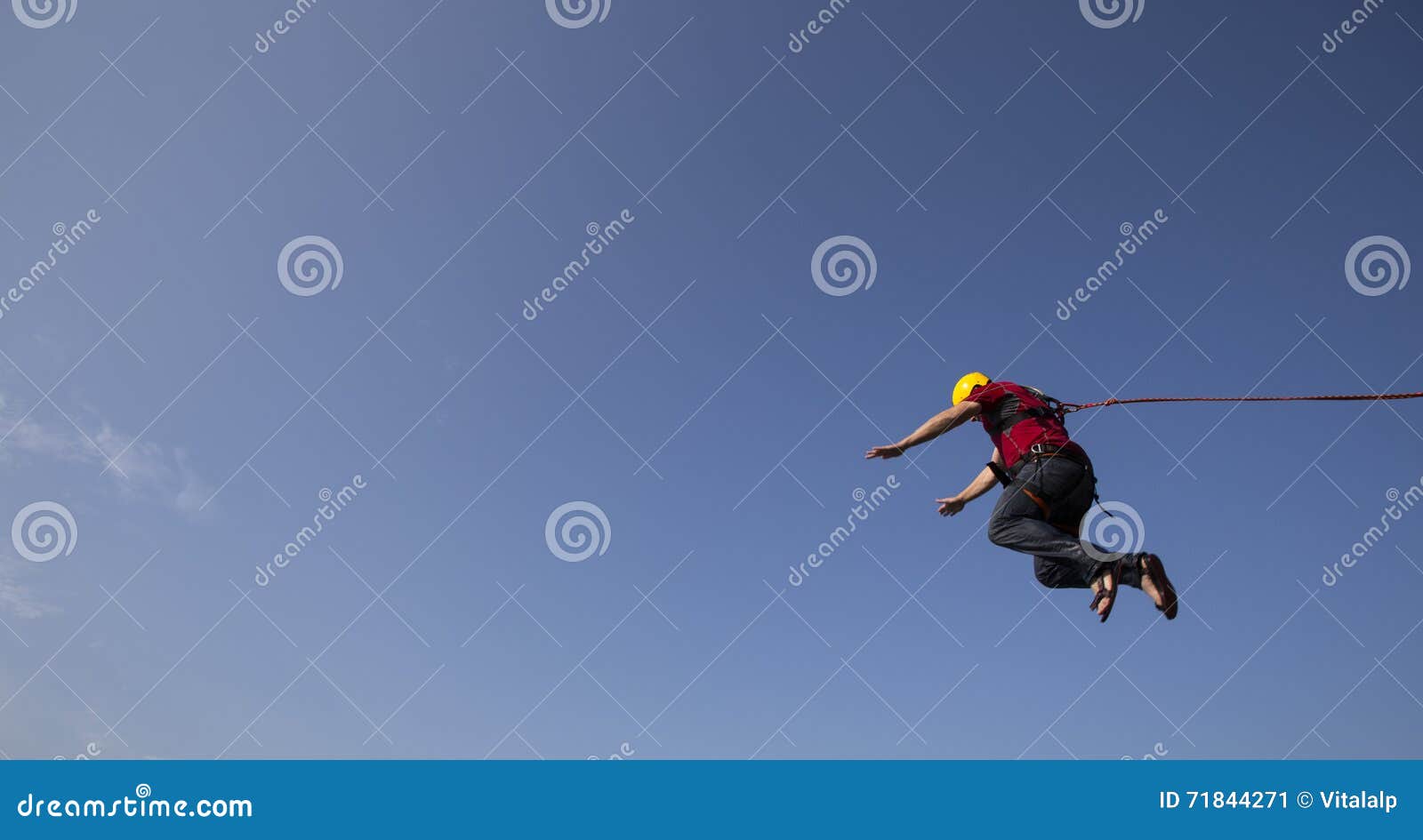 Man jumping off a cliff. stock image. Image of clear - 71844271