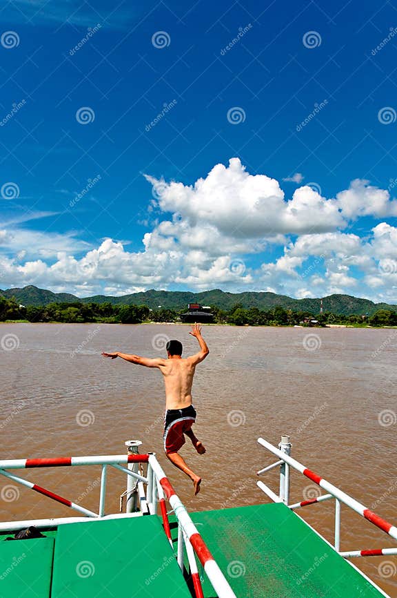 Man Jumping Off River Raft into Water Stock Image - Image of vessel ...