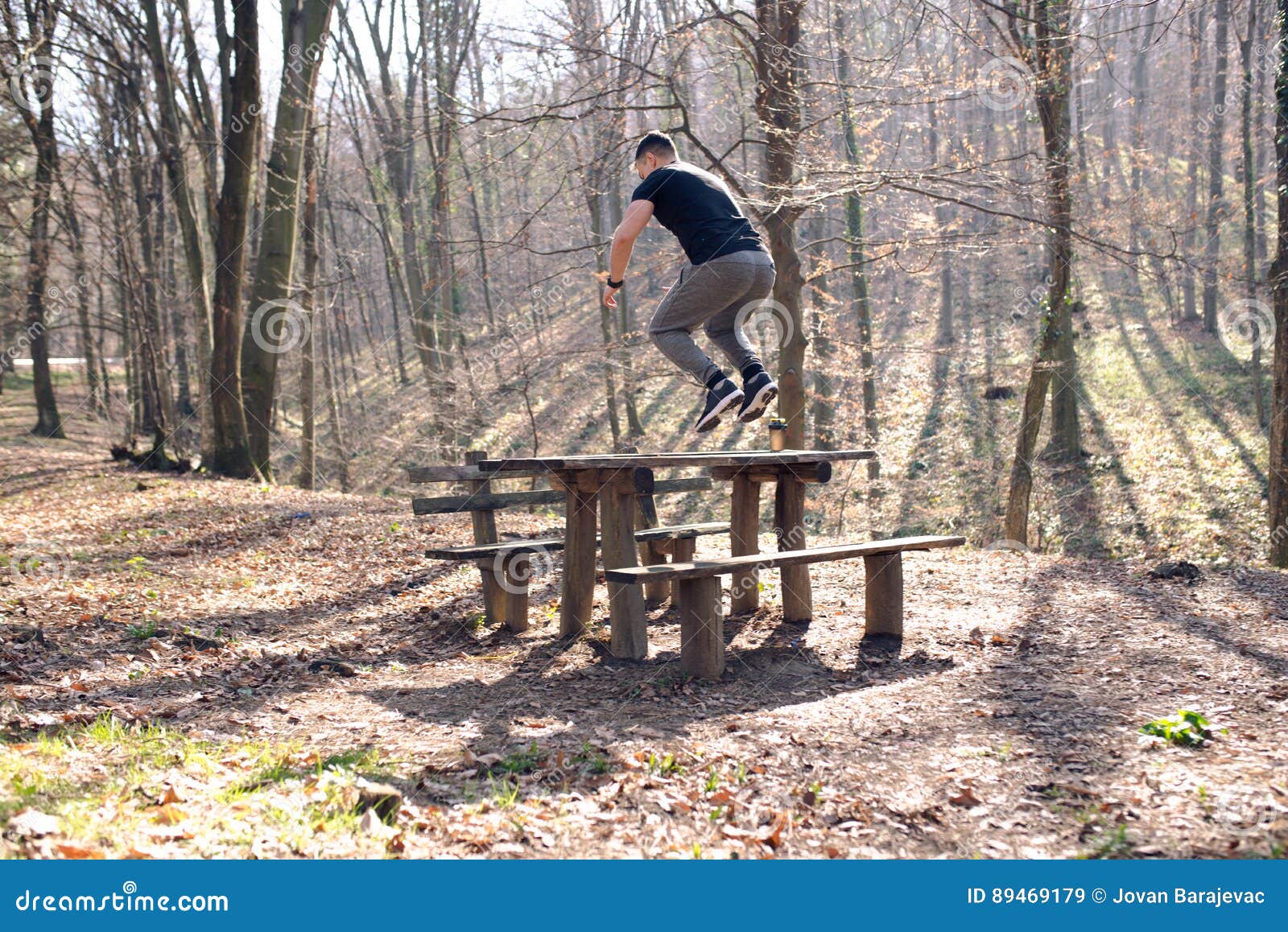 Man jumping over the bench stock image. Image of hiking - 89469179