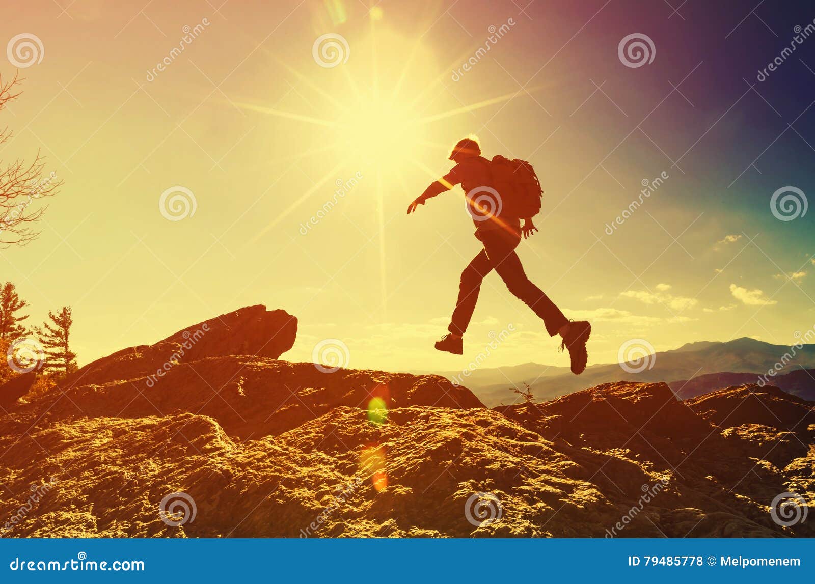 Man Jumping Over Gap on Mountain Hike Stock Photo - Image of climb ...