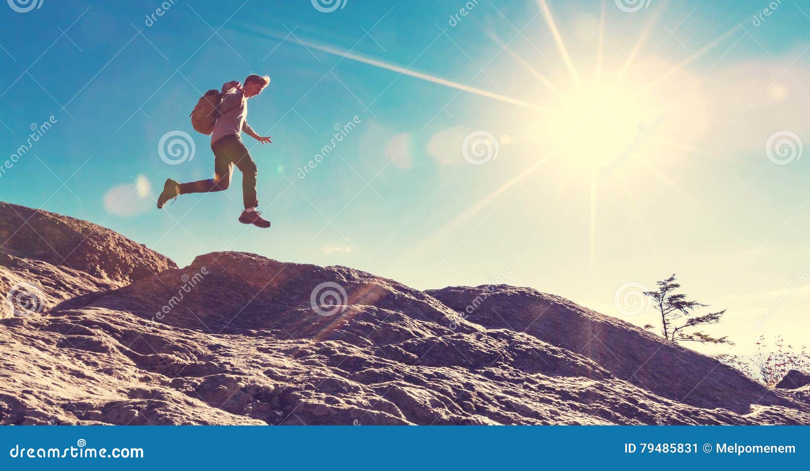 Man Jumping Over Gap on Mountain Hike Stock Image - Image of hiking ...