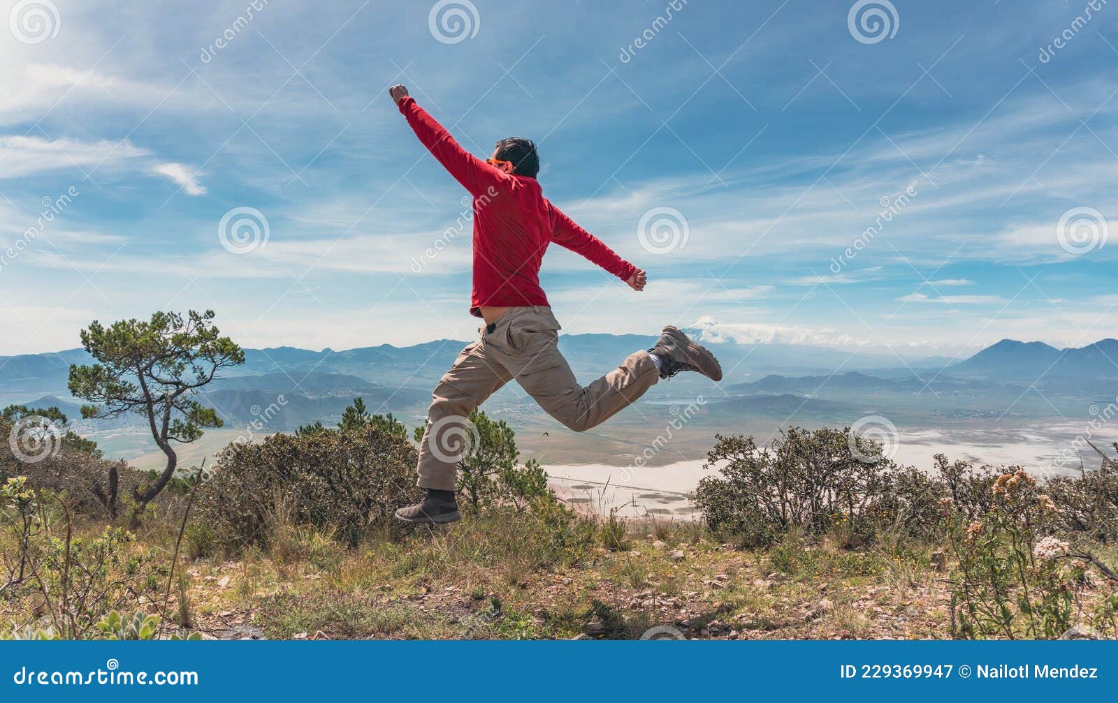 Man Jumping Over Rocks in Mountain Stock Image - Image of jump, jumping ...