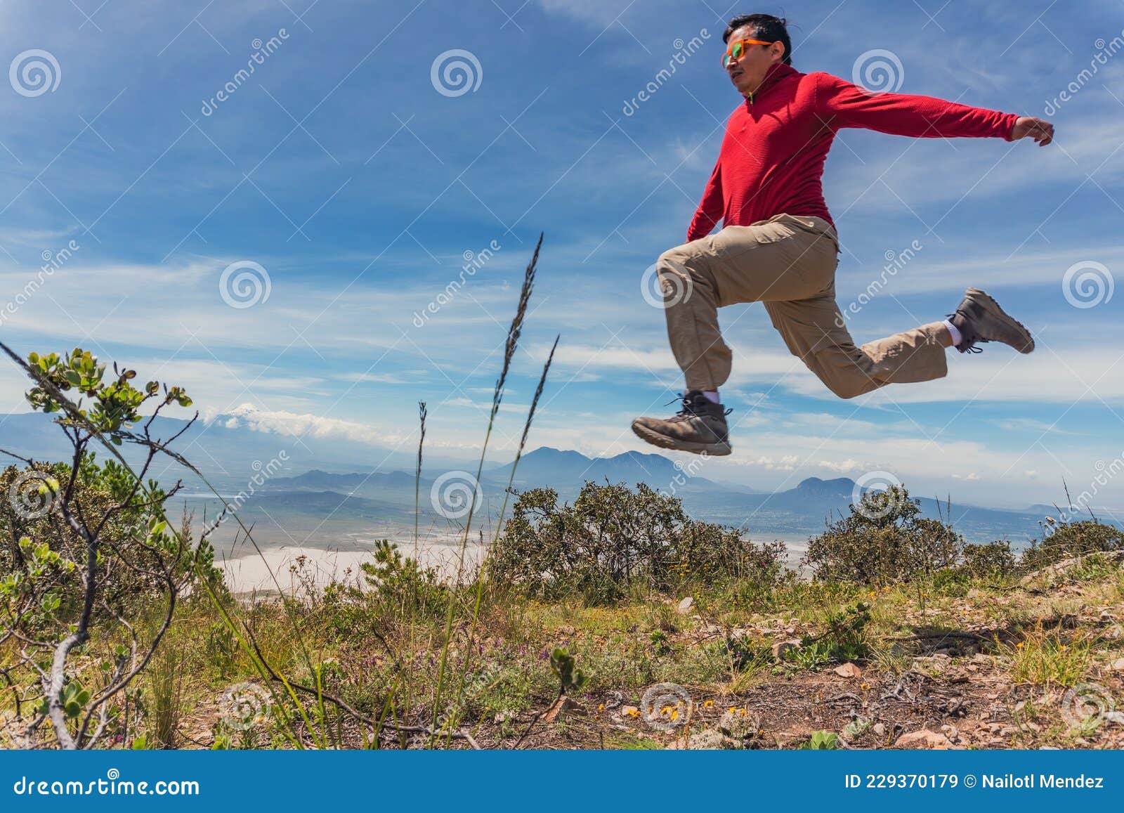 Man Jumping Over Rocks in Mountain Stock Image - Image of lifestyle ...
