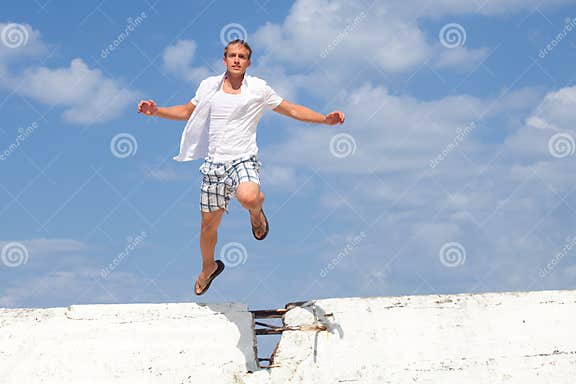 Man Jumping Over Wall stock image. Image of handsome - 20354579