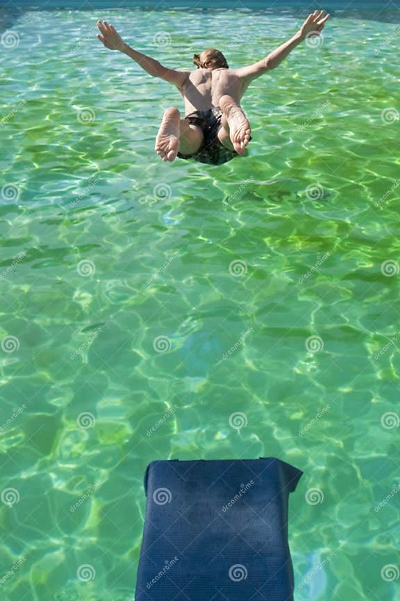 Man jumping in the pool. stock photo. Image of hotel - 48525484