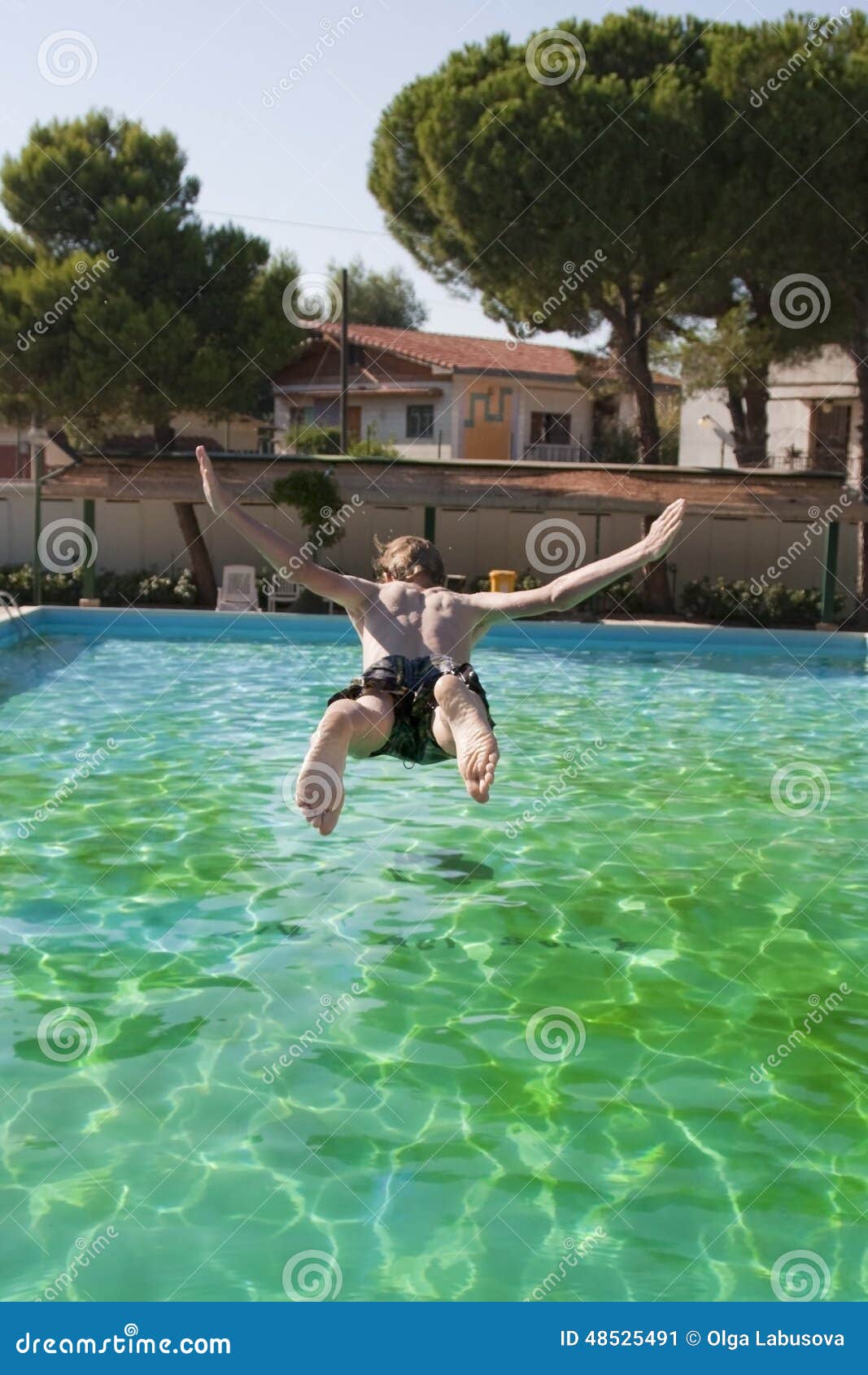 Man jumping in the pool. stock image. Image of body, muscular - 48525491