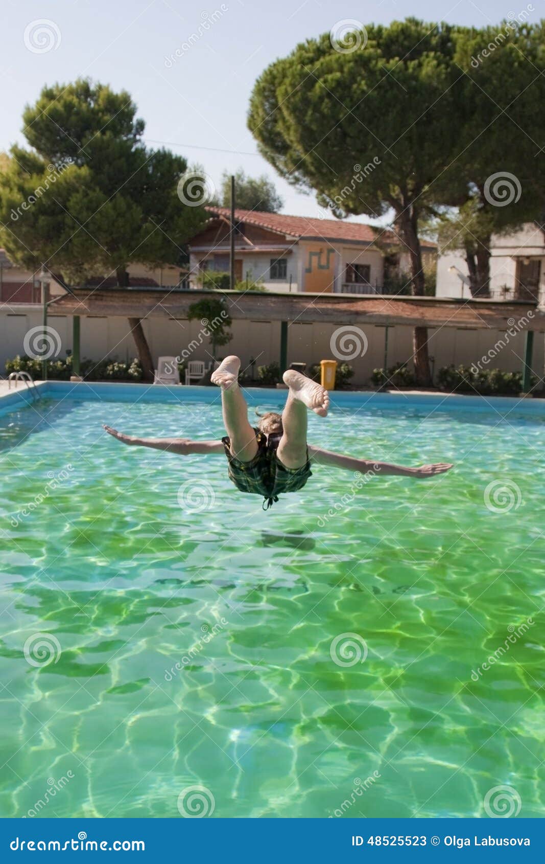 Man jumping in the pool. stock image. Image of actions - 48525523