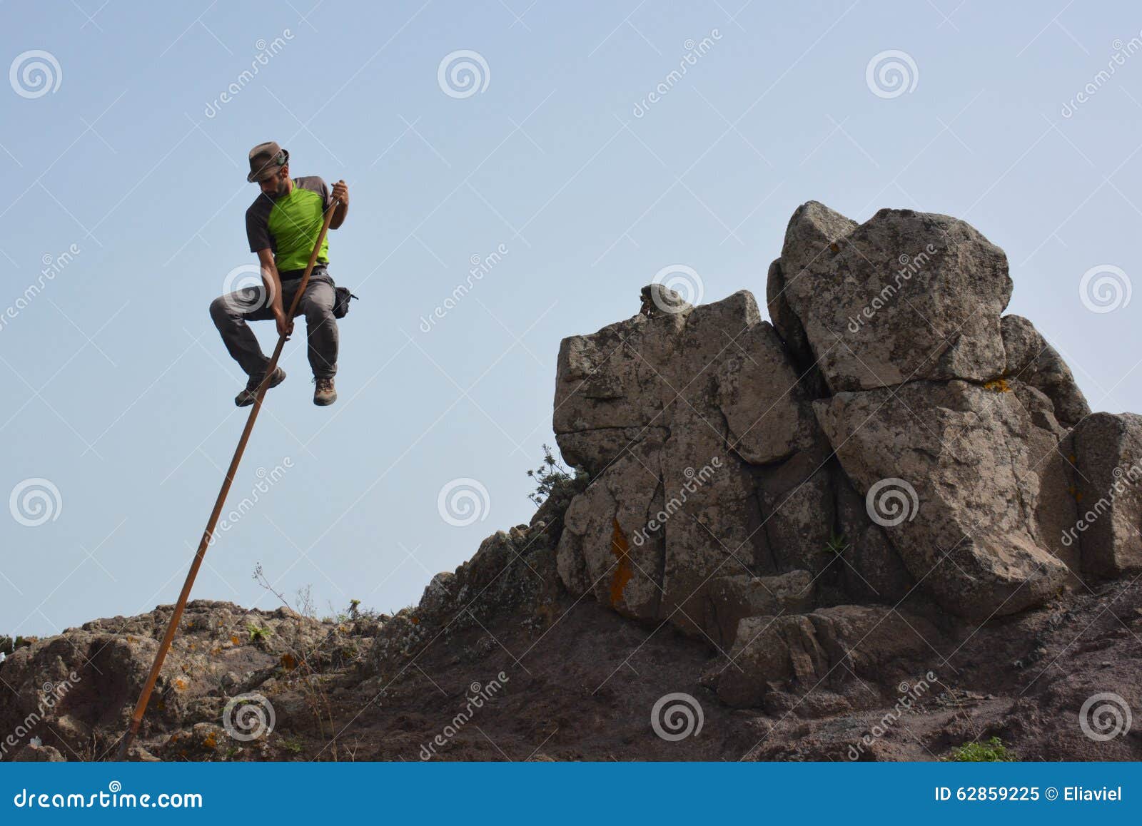 A man jumping from a rock editorial image. Image of motion - 62859225