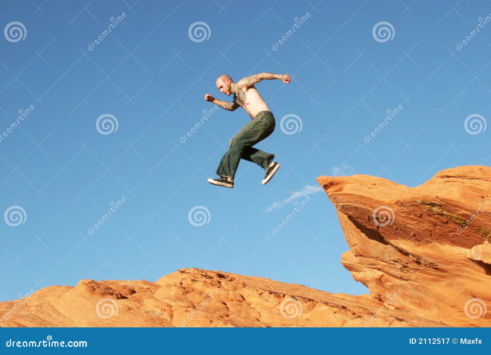 Man jumping on rocks stock image. Image of piercing, nature - 2112517