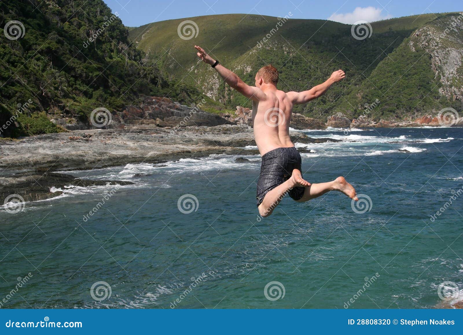 Man Jumping into Sea stock photo. Image of young, energy - 28808320