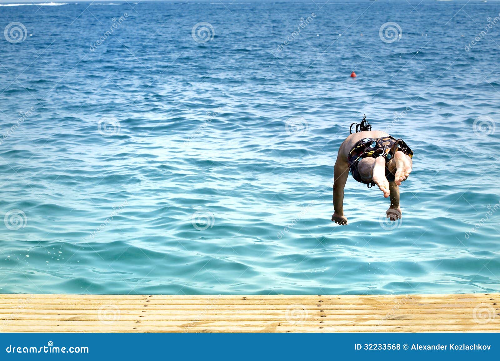 Man jumping in the sea stock photo. Image of recreational - 32233568