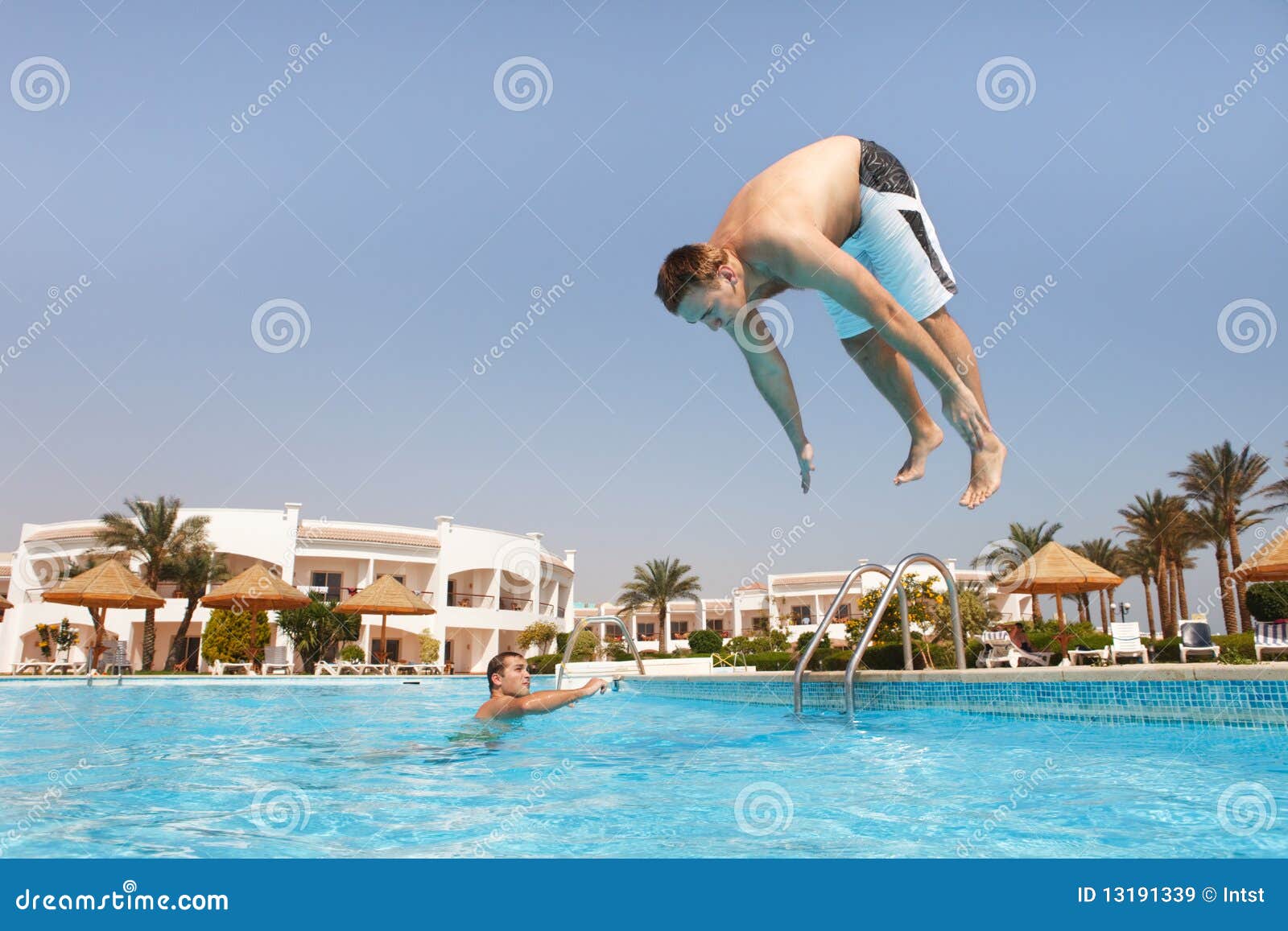 Man Jumping in Swimming Pool Stock Image - Image of athletic, hotel ...