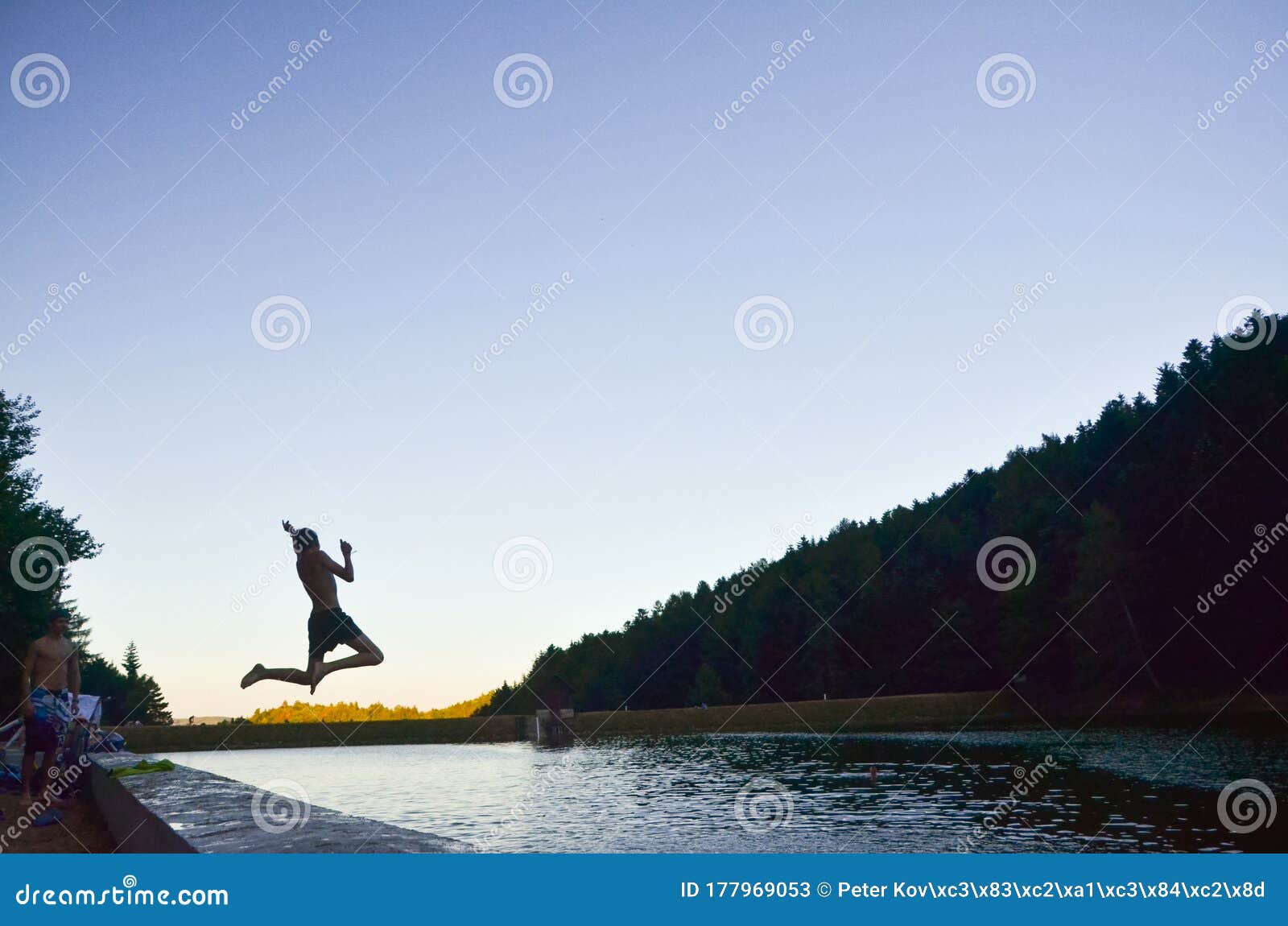 Man Jumping To the Water in Summer in Summer Evening Stock Image ...