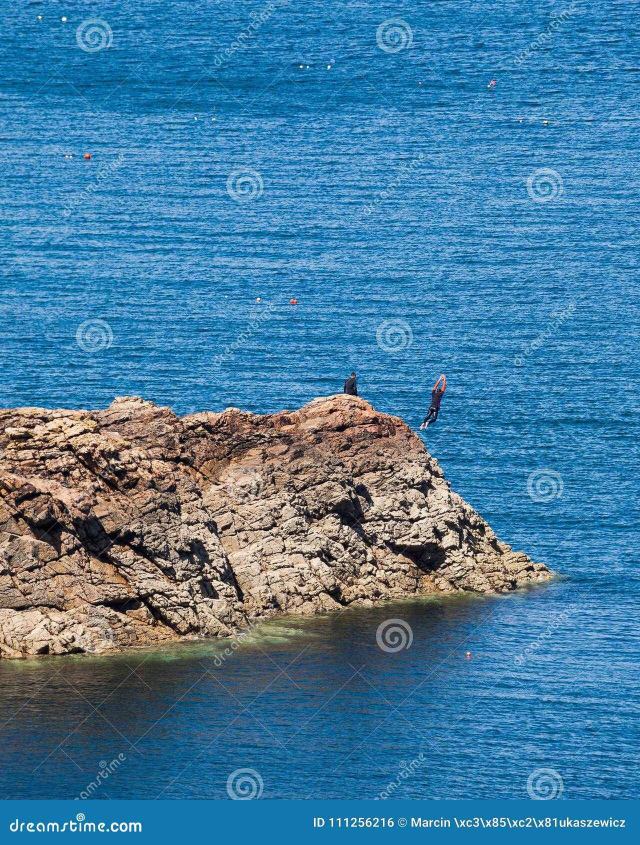 Man jumps of the cliff stock photo. Image of extremal - 111256216