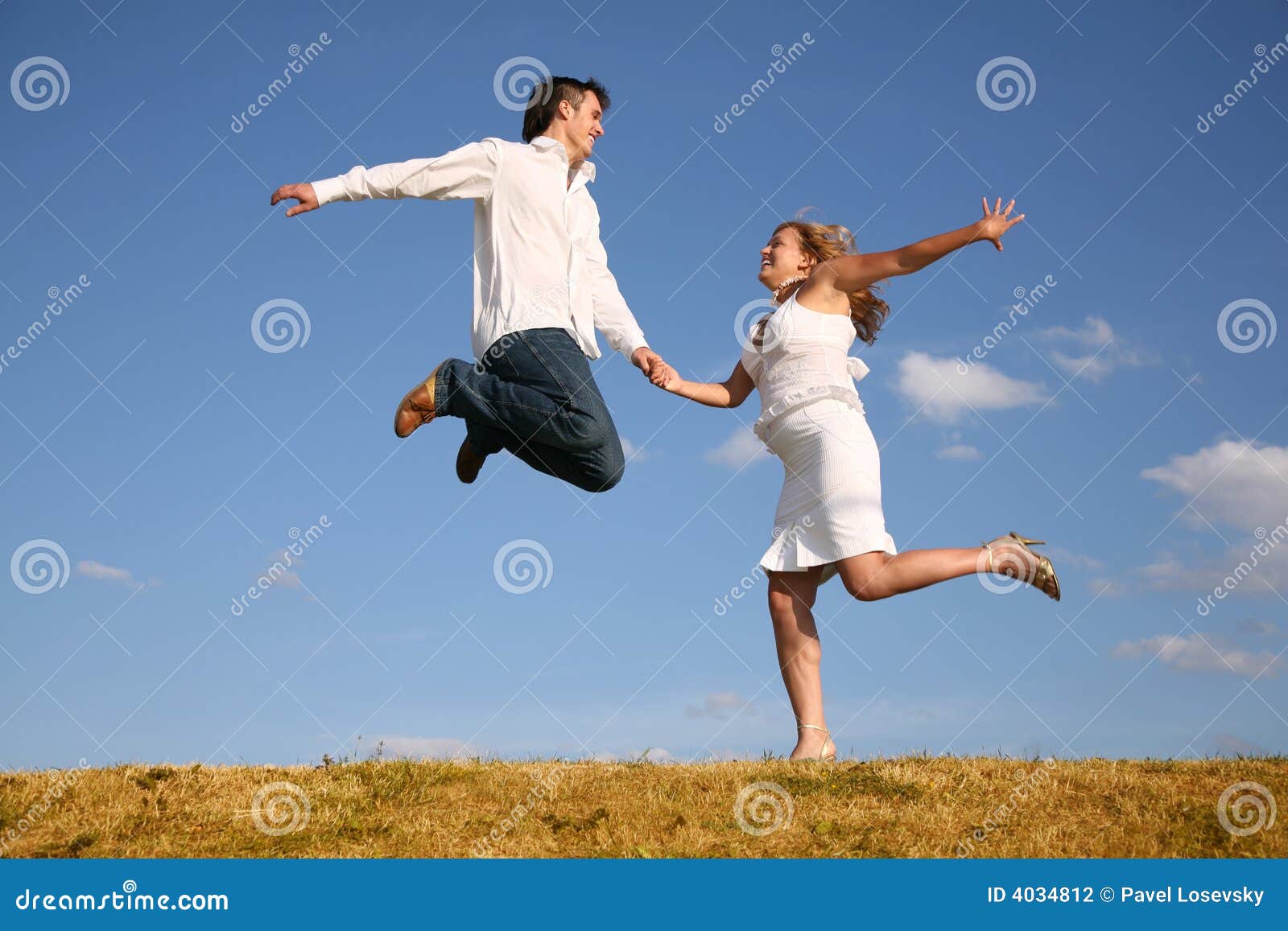 Man Jumps Hold Girl from Hand Stock Photo - Image of outdoors ...