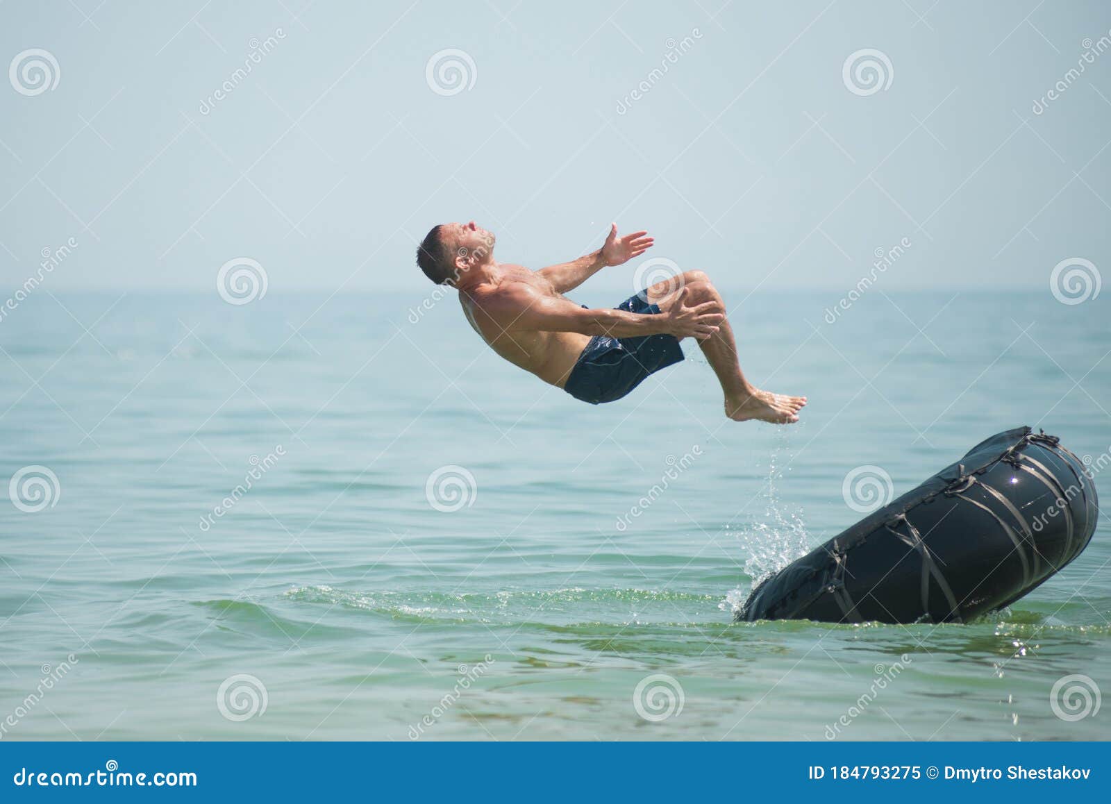 Man Jumps from an Inflated Camera into the Sea Stock Image - Image of ...