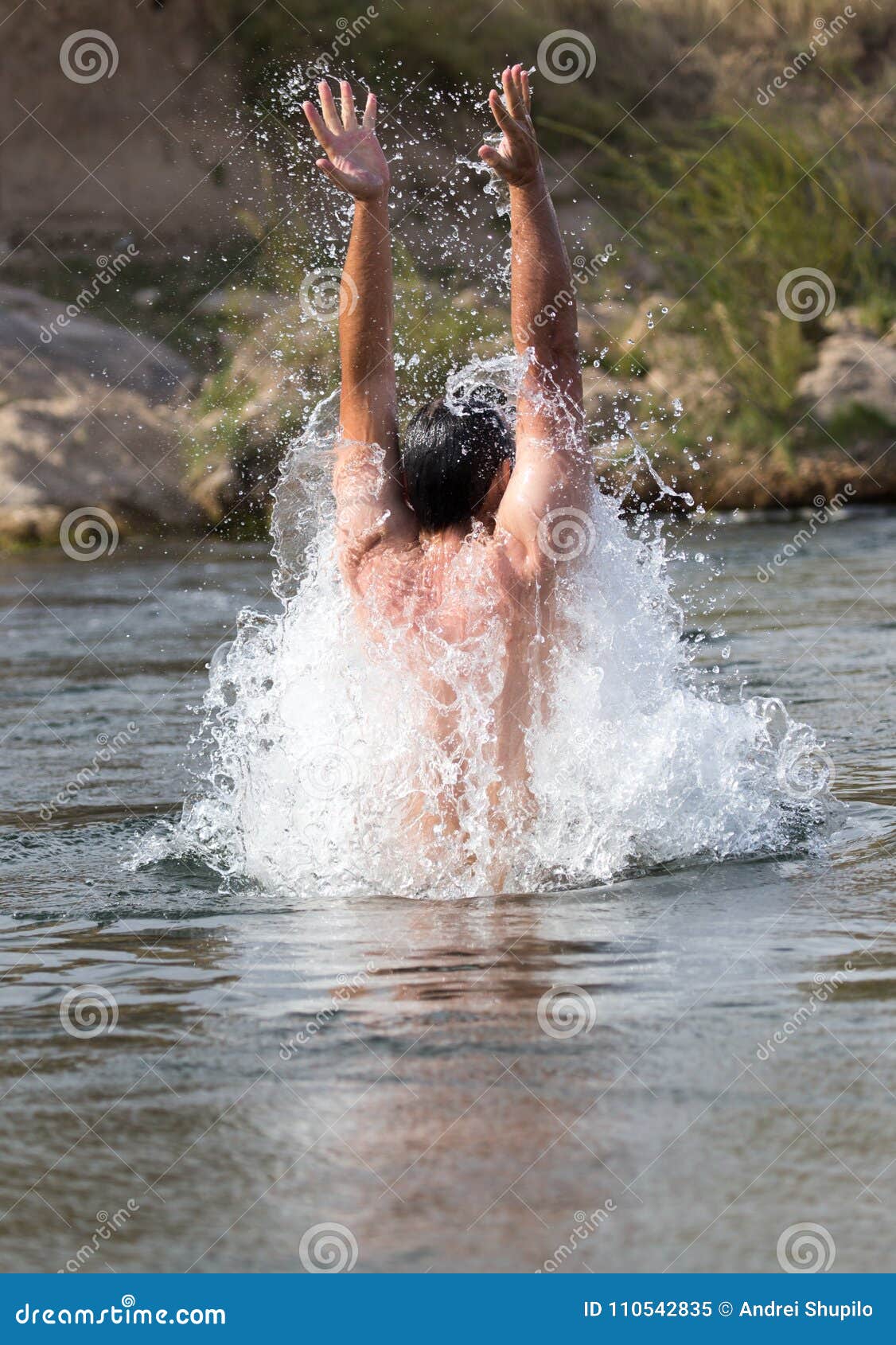 A Man Jumps Out of the Water Stock Image - Image of jump, muscular ...