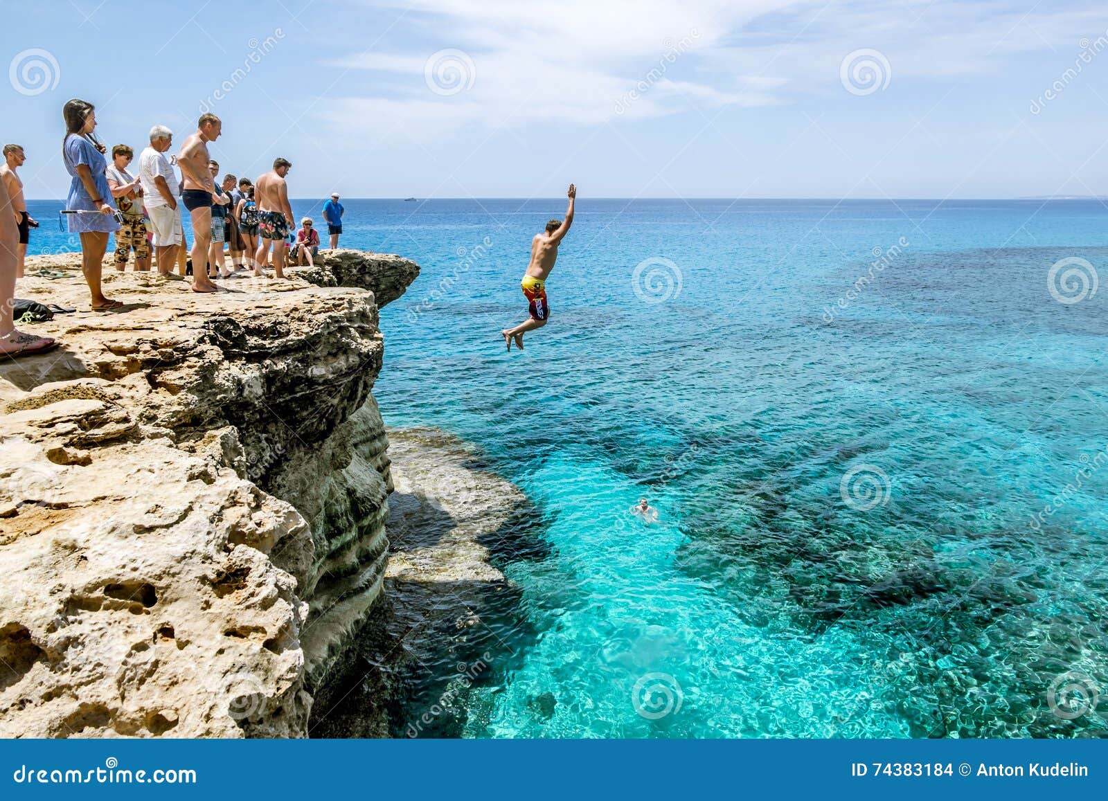 Man Jumps into Sea from a Cliff at Cape Greco . Cyprus Editorial Stock ...