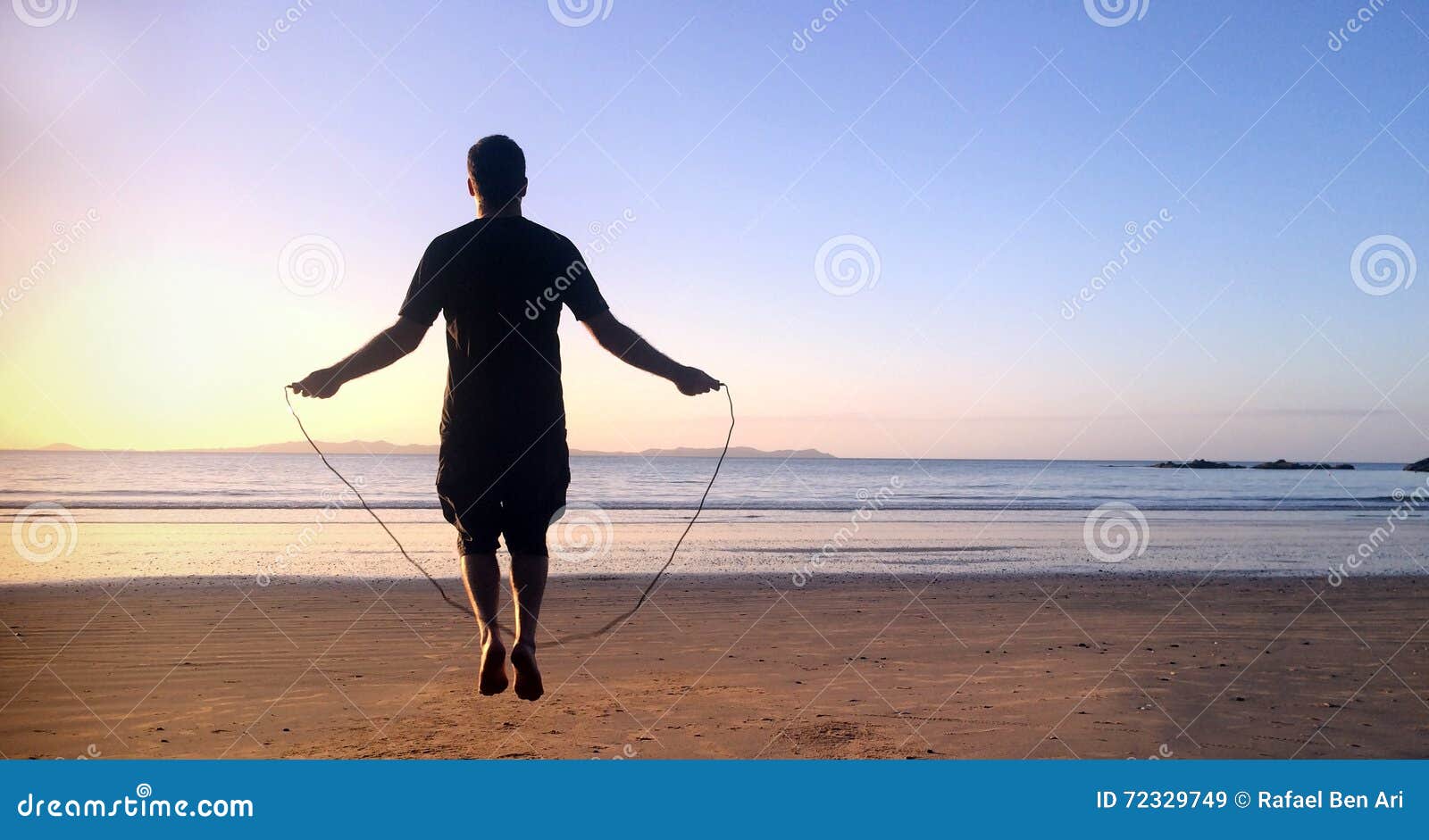Man Jumps on Skipping Rope in the Beach Stock Image - Image of clear ...