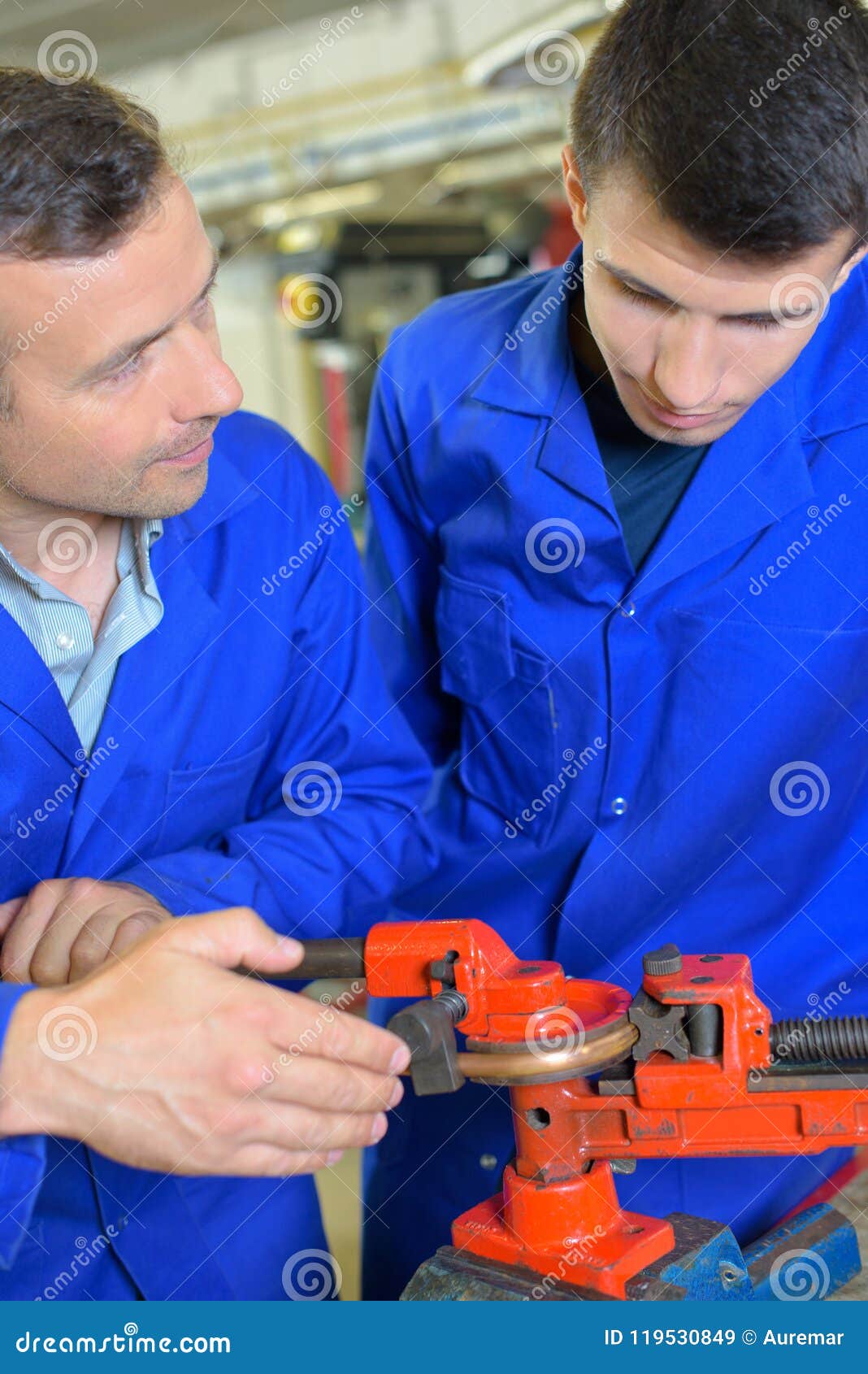 Man and Junior Worker Using Jack Stock Image - Image of construction ...