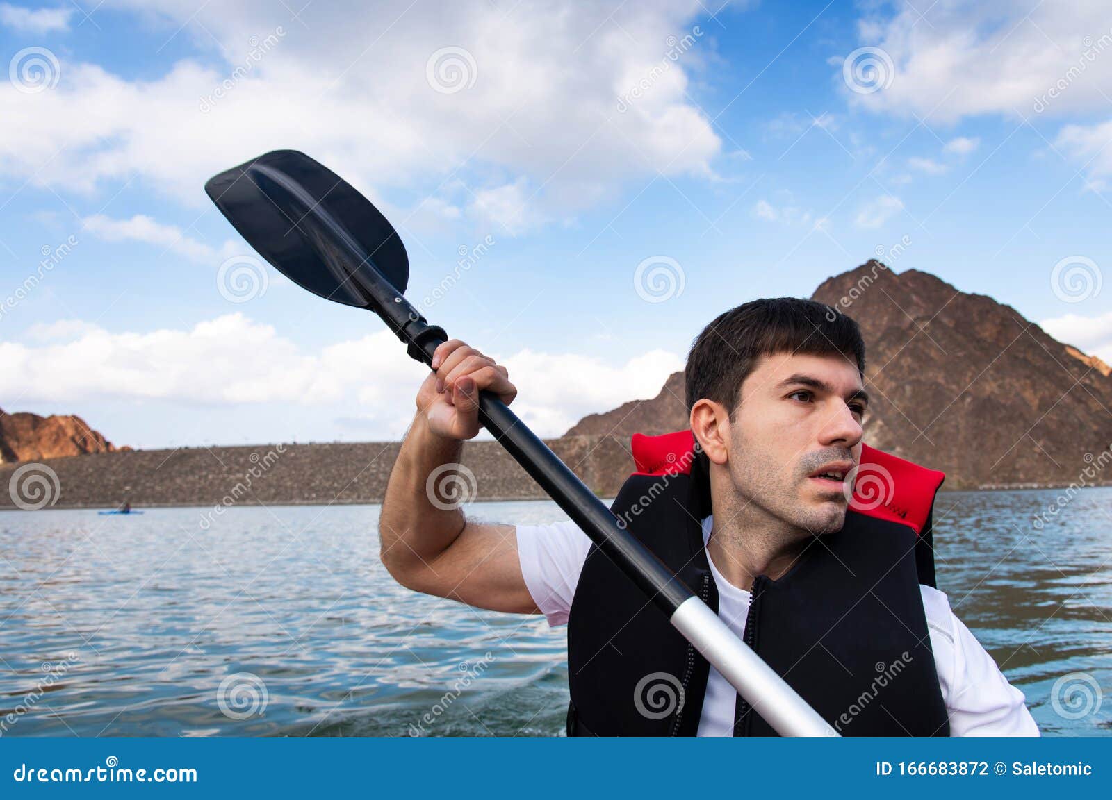 Man Kayaking in a Lake Closeup Stock Photo - Image of hill, oman: 166683872