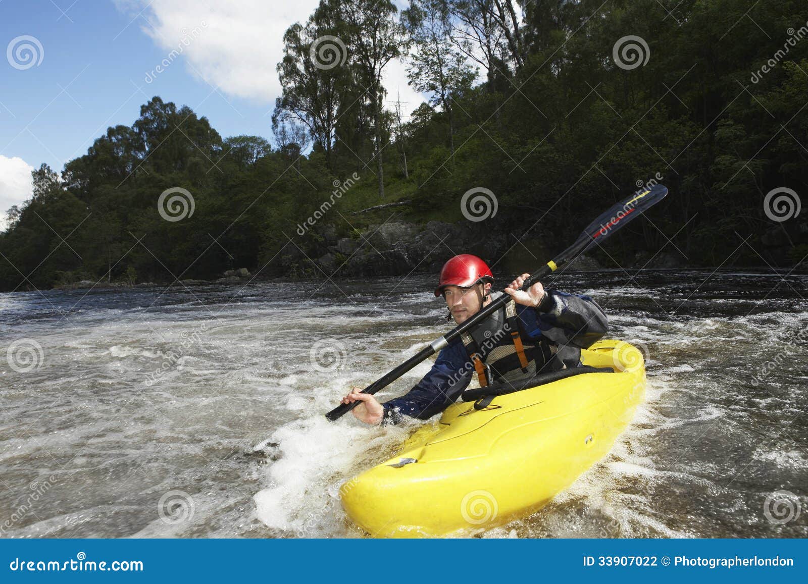 Man kayaking in river stock photo. Image of paddling - 33907022
