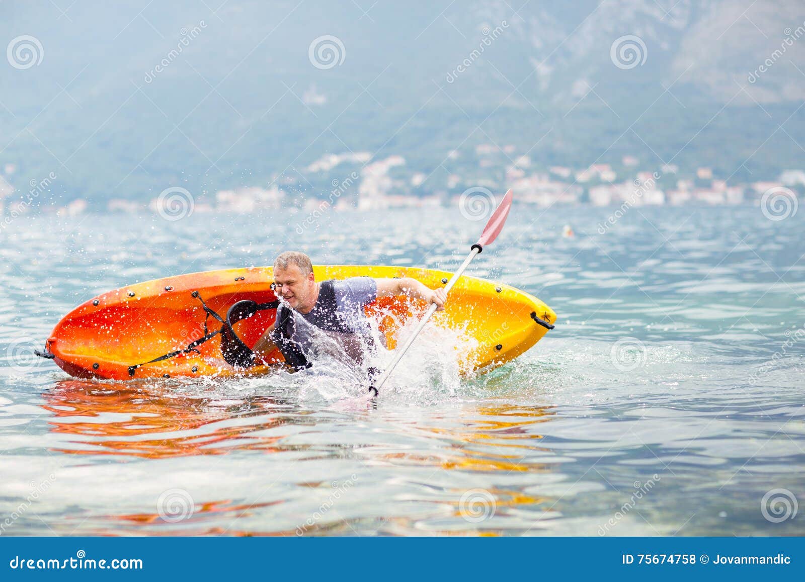 Man Kayaking on the Sea, Falling Out of the Kayak Stock Photo - Image ...