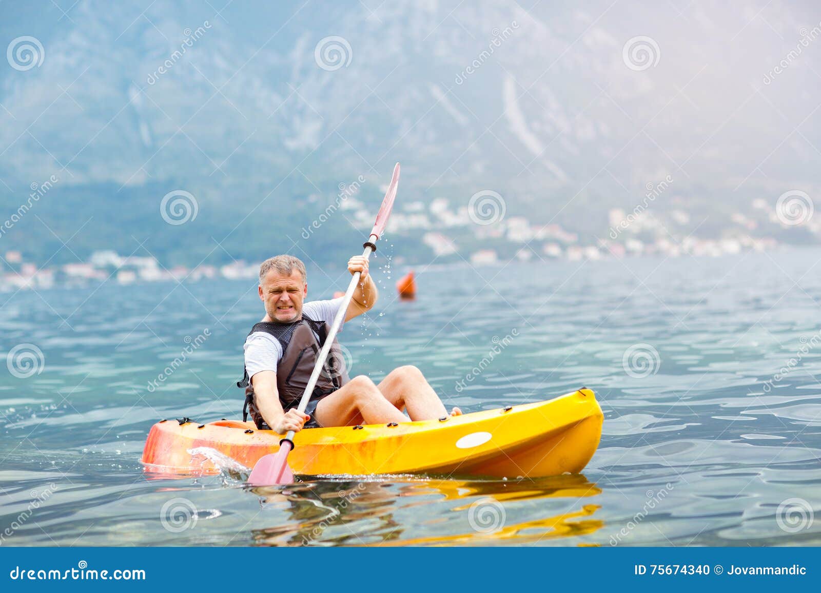 Man kayaking on the sea stock photo. Image of summer - 75674340