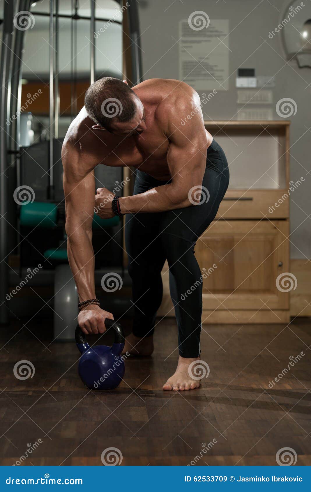 Man and Kettle Bell stock image. Image of kettlebell - 62533709