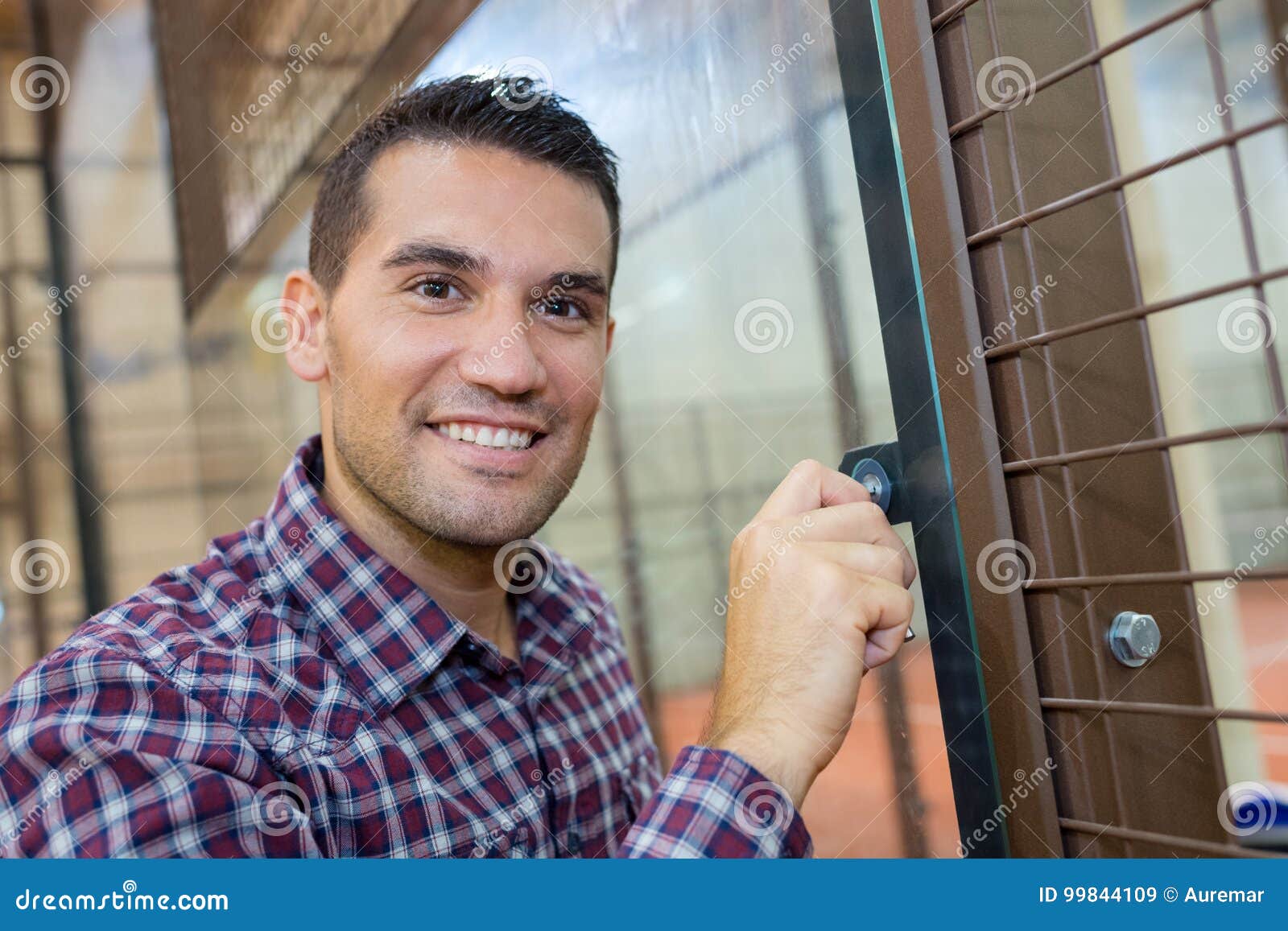 Man with Key in Lock Store Shutter Stock Image - Image of burglary ...