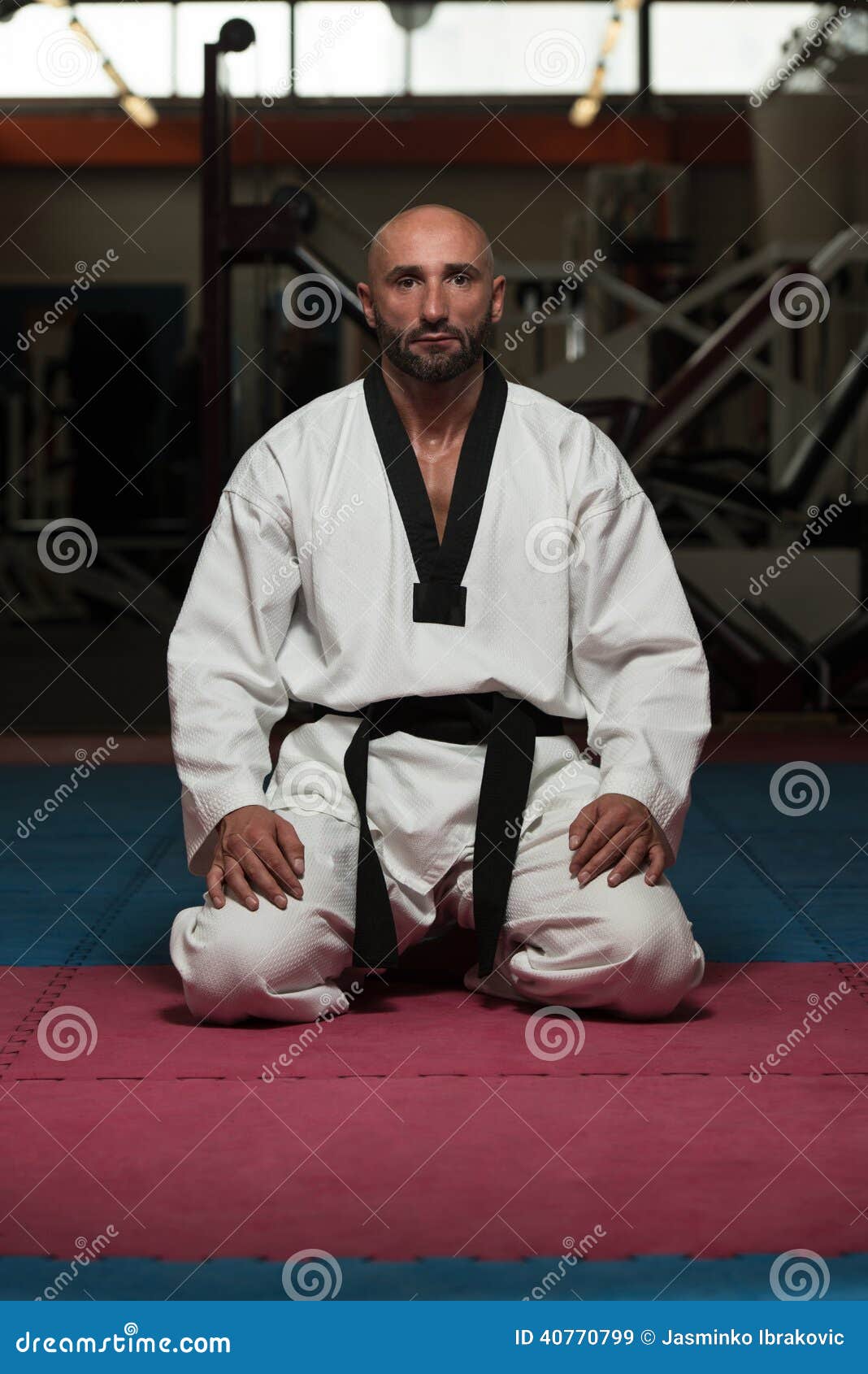 Man in a Kimono with a Black Belt Meditates Stock Image - Image of ...