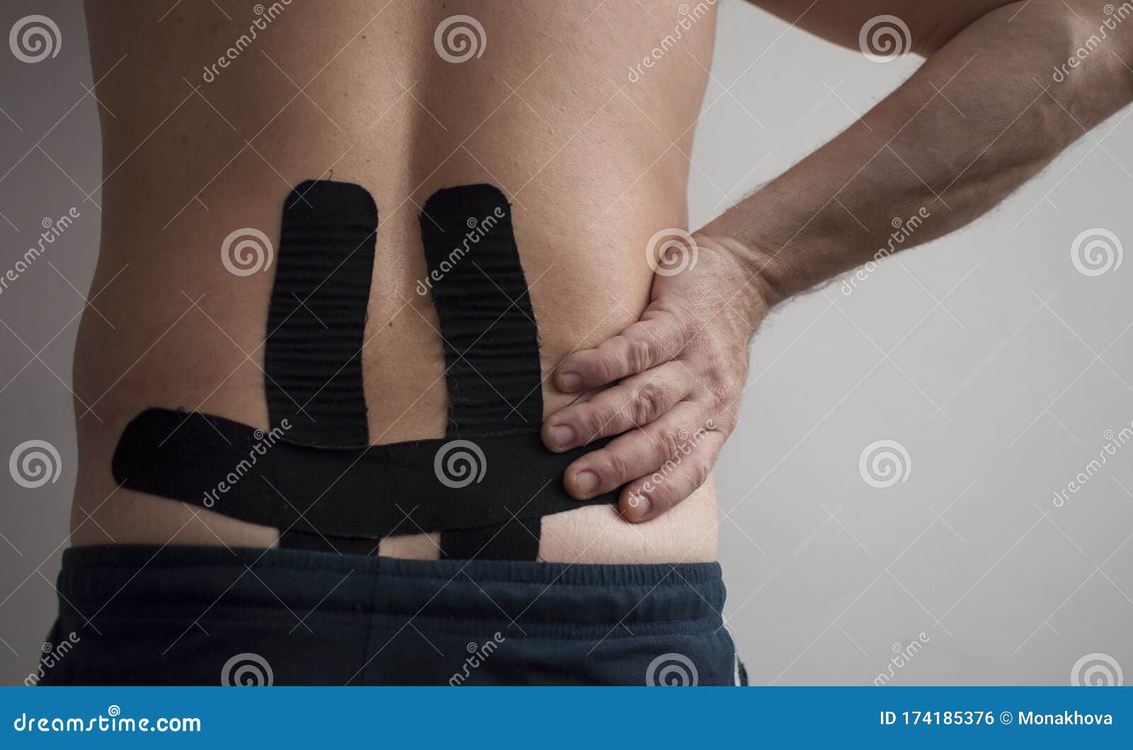 Man with Kinesio Tape on His Back. Back Pain Stock Photo - Image of ...