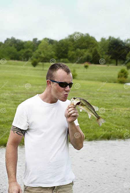 Man Kissing Fish stock photo. Image of kiss, happiness - 18744356