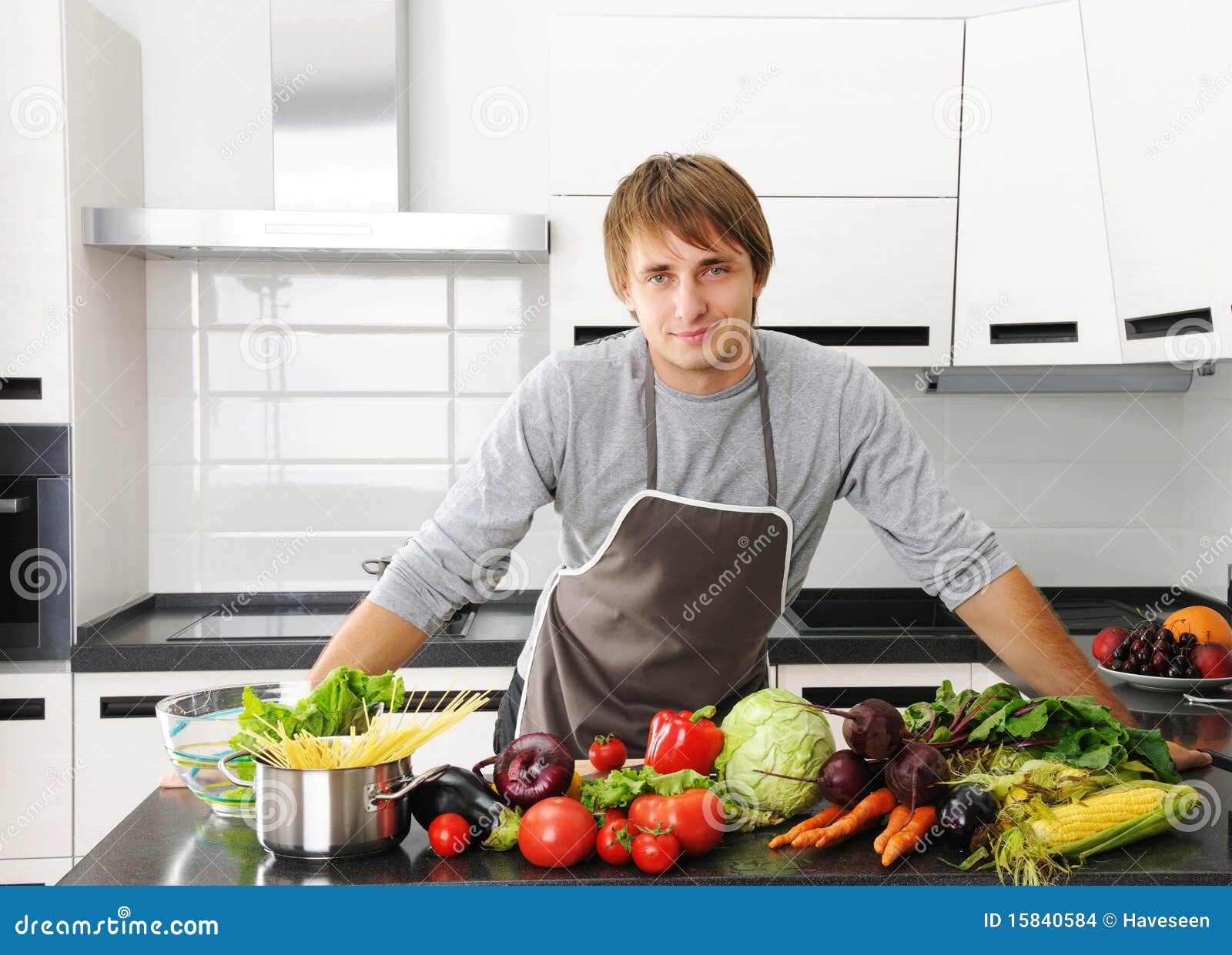 Man in kitchen stock photo. Image of young, vegetable - 15840584