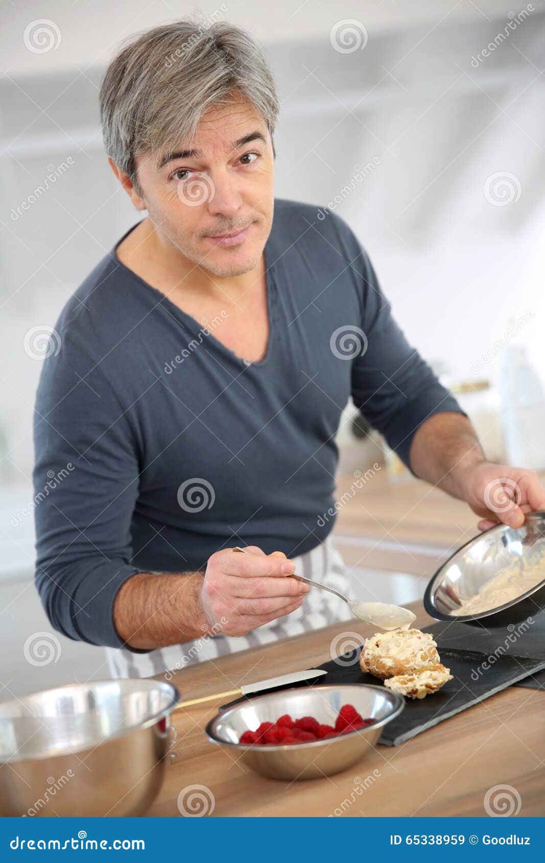 Man in the kitchen cooking stock image. Image of puff - 65338959