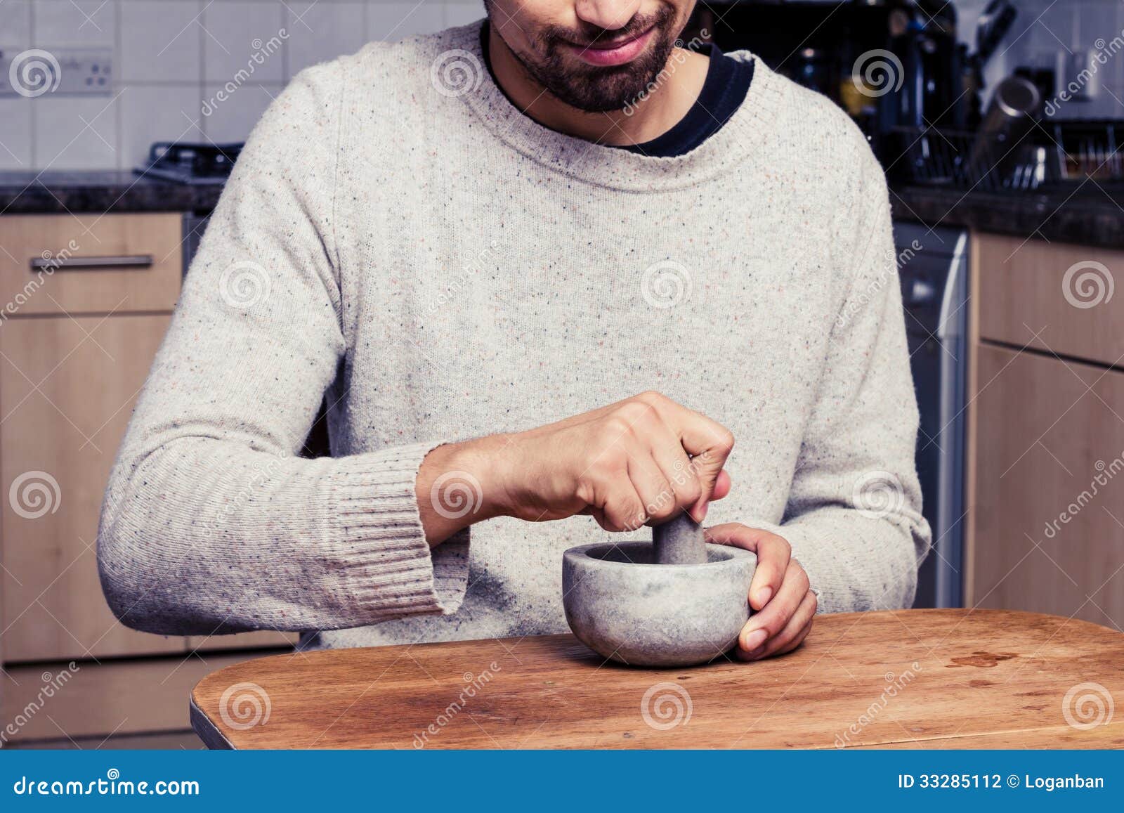 Man in Kitchen is Grinding Spices Stock Photo - Image of mortar, ground ...