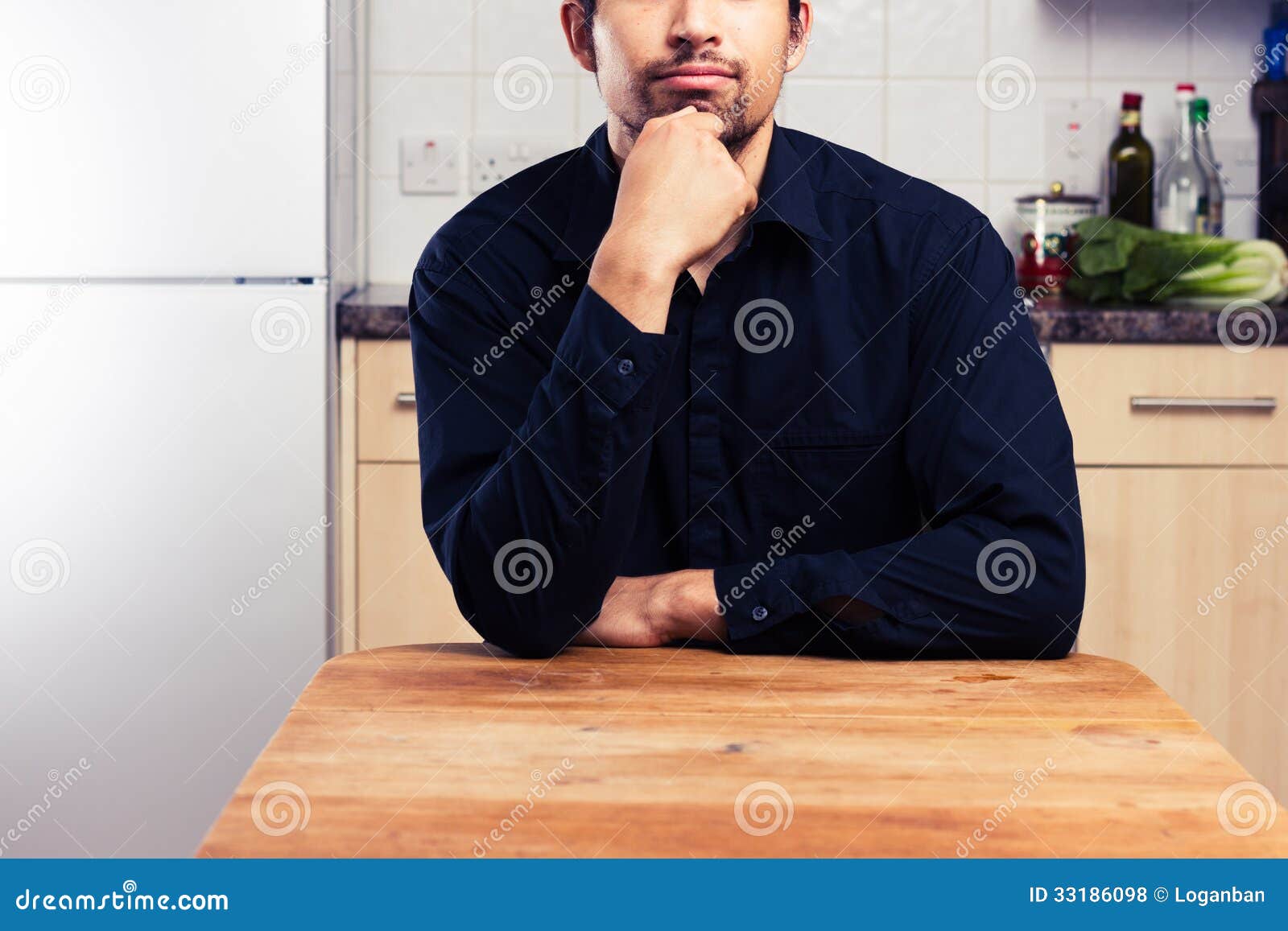 Man at Kitchen Table Thinking Stock Photo - Image of table, calm: 33186098