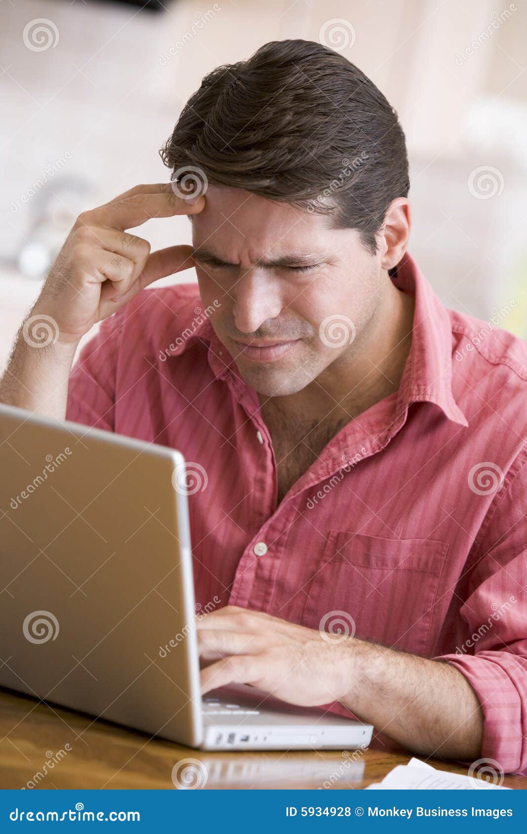 Man in Kitchen Using Laptop Frowning Stock Photo - Image of technology ...