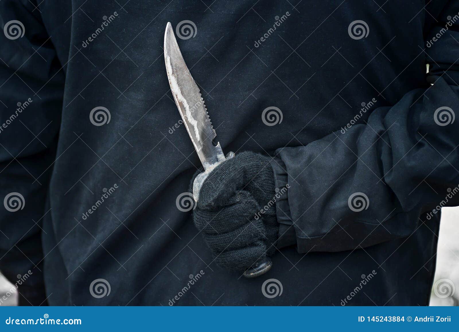 Man with the Knife. Hand with a Knife Behind His Back Stock Photo ...