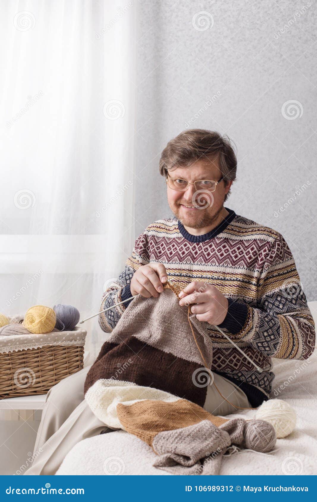 The man knits at home stock photo. Image of hand, happy - 106989312